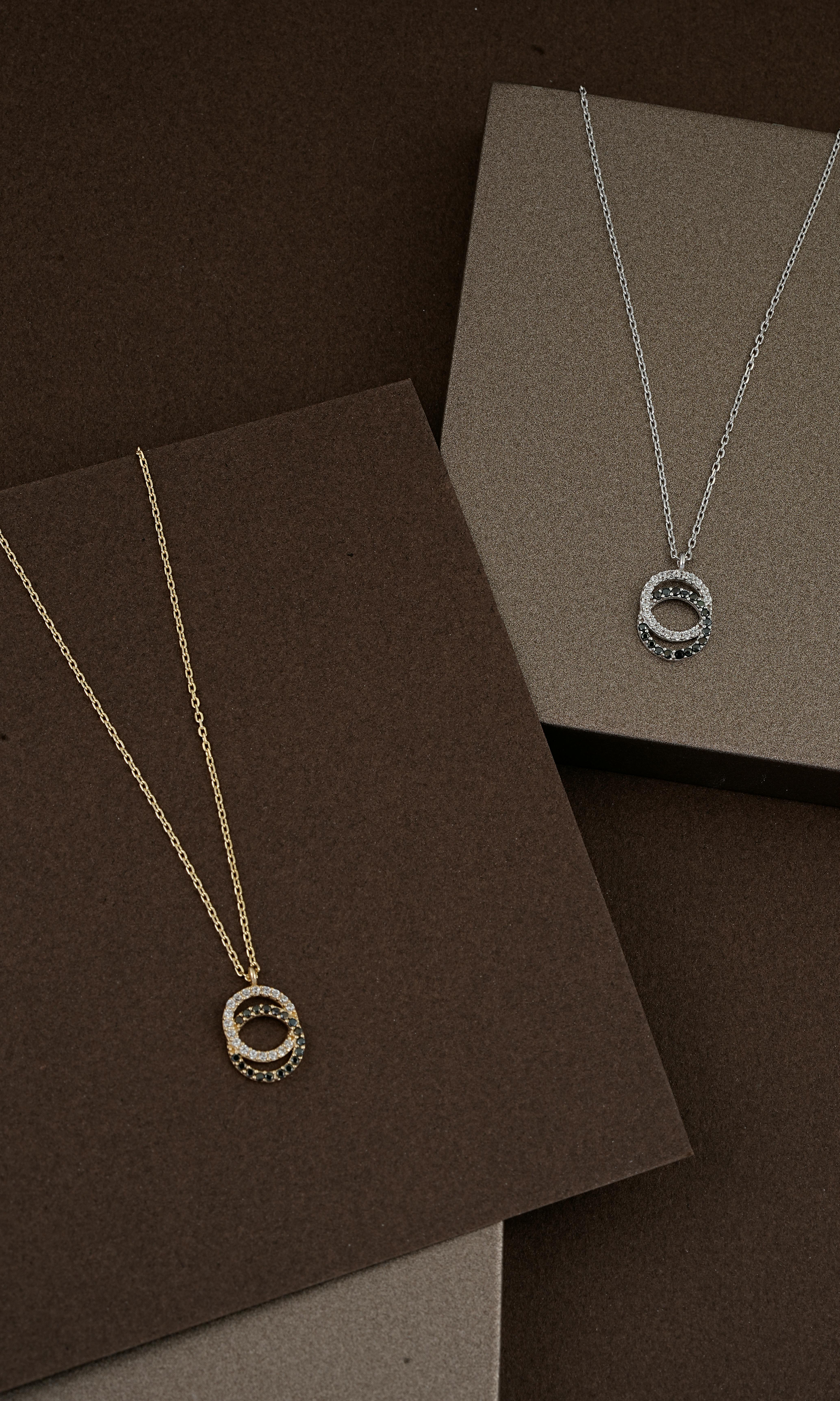 Elegant Gold and Silver Necklaces on Display · Free Stock Photo
