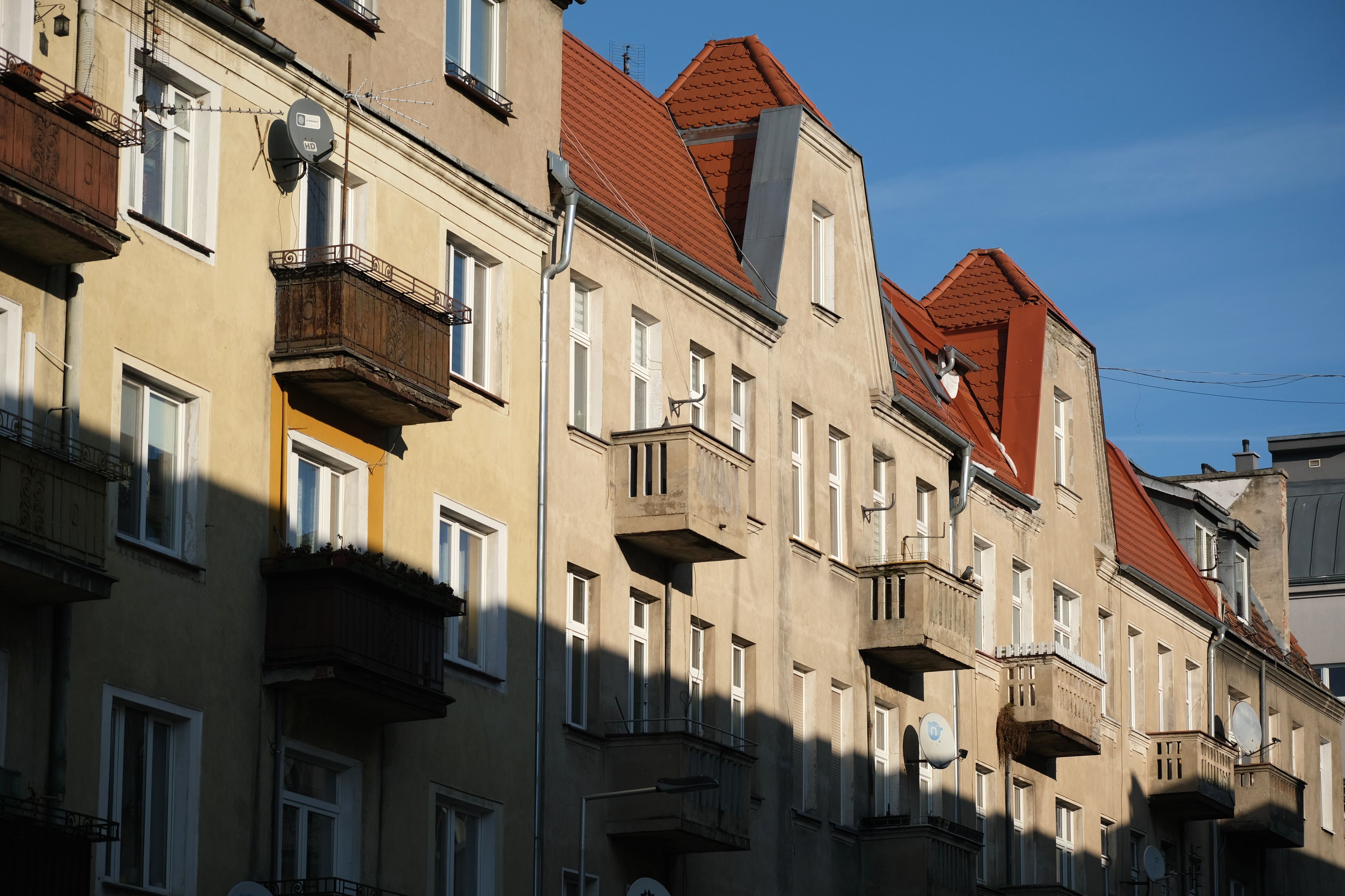 Traditional European Apartment Building in Sunlight · Free Stock Photo