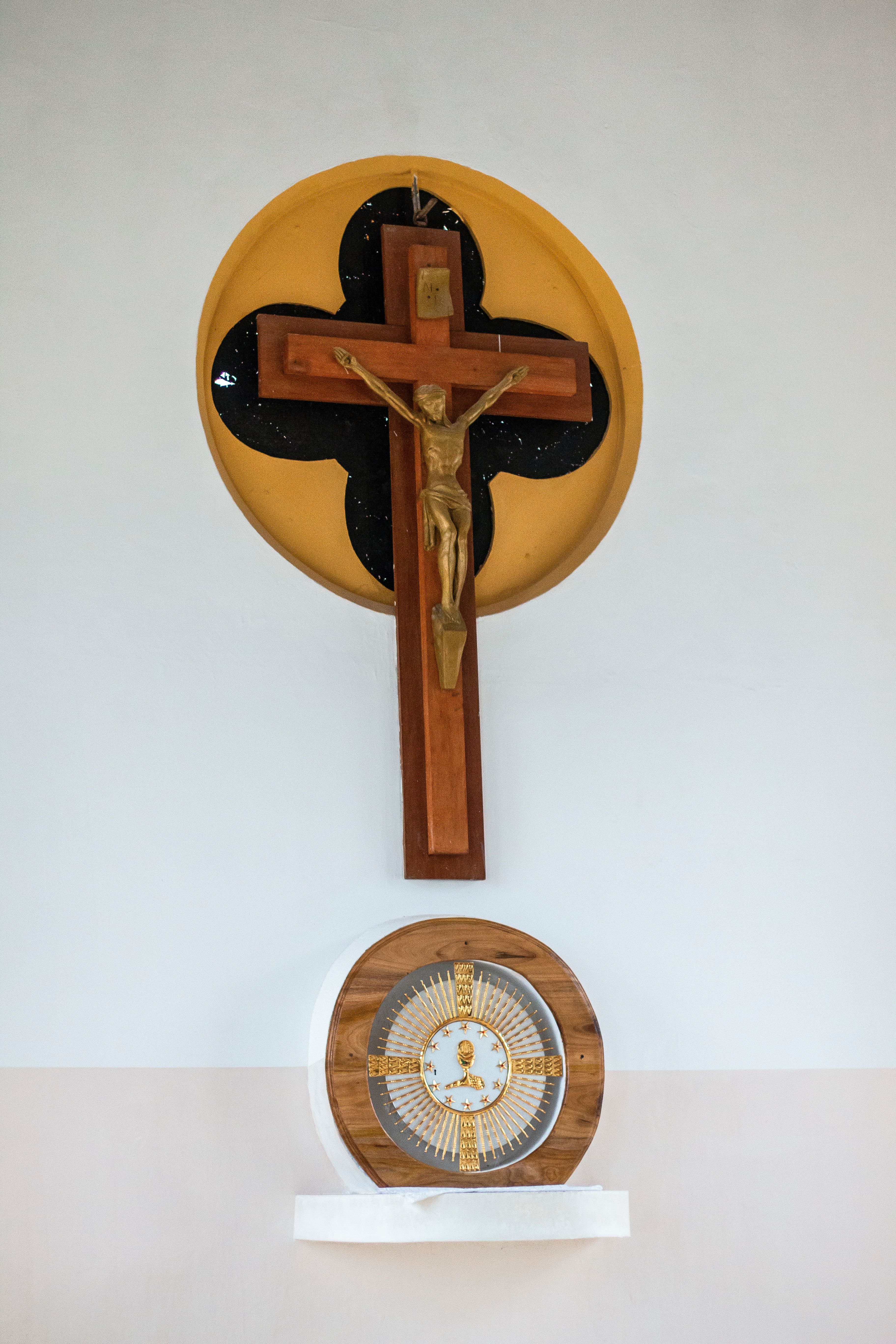 Wall-mounted Crucifix and Decorative Clock in Ghana · Free Stock Photo