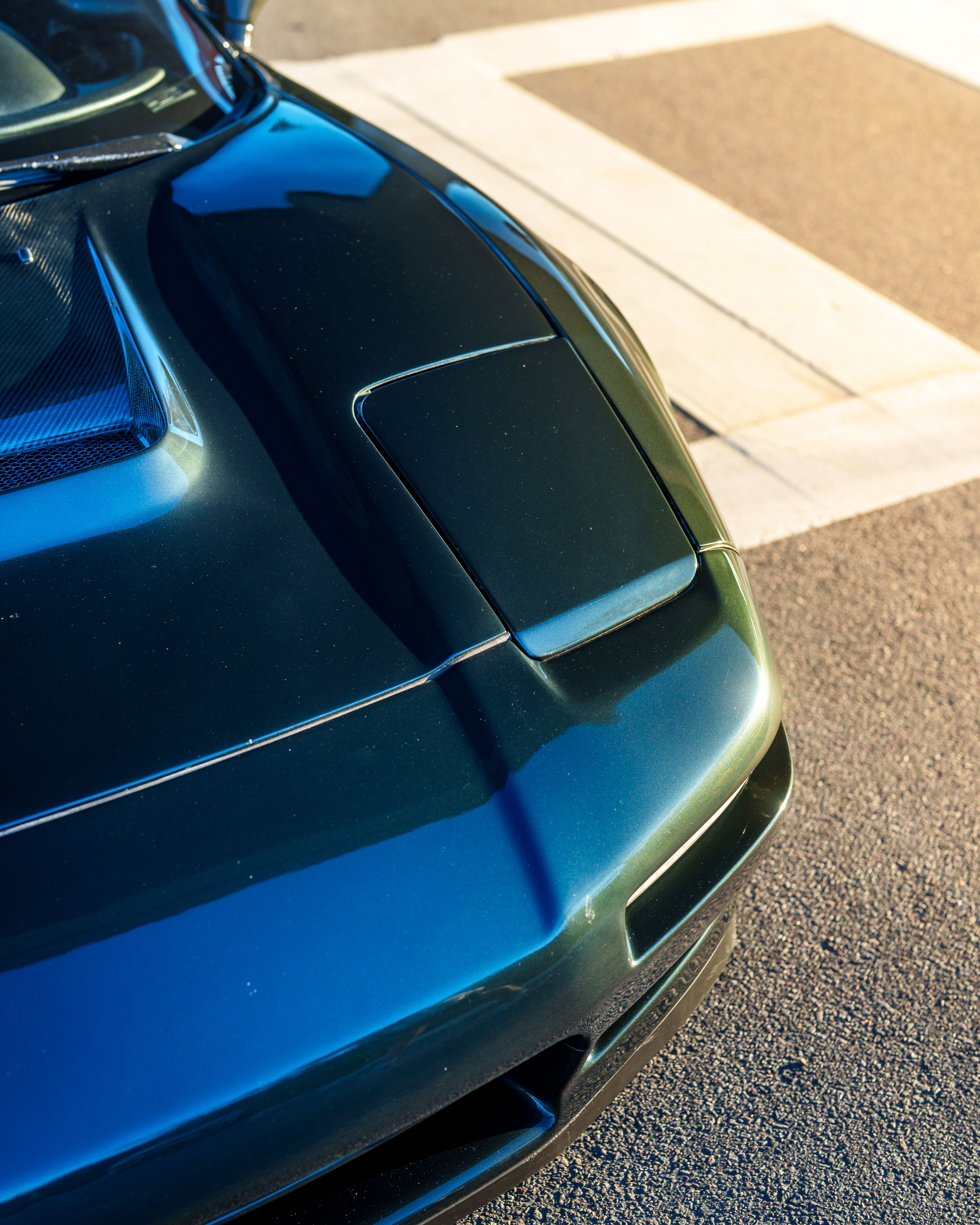 Close-up of a Classic Sports Car in Sunlight · Free Stock Photo