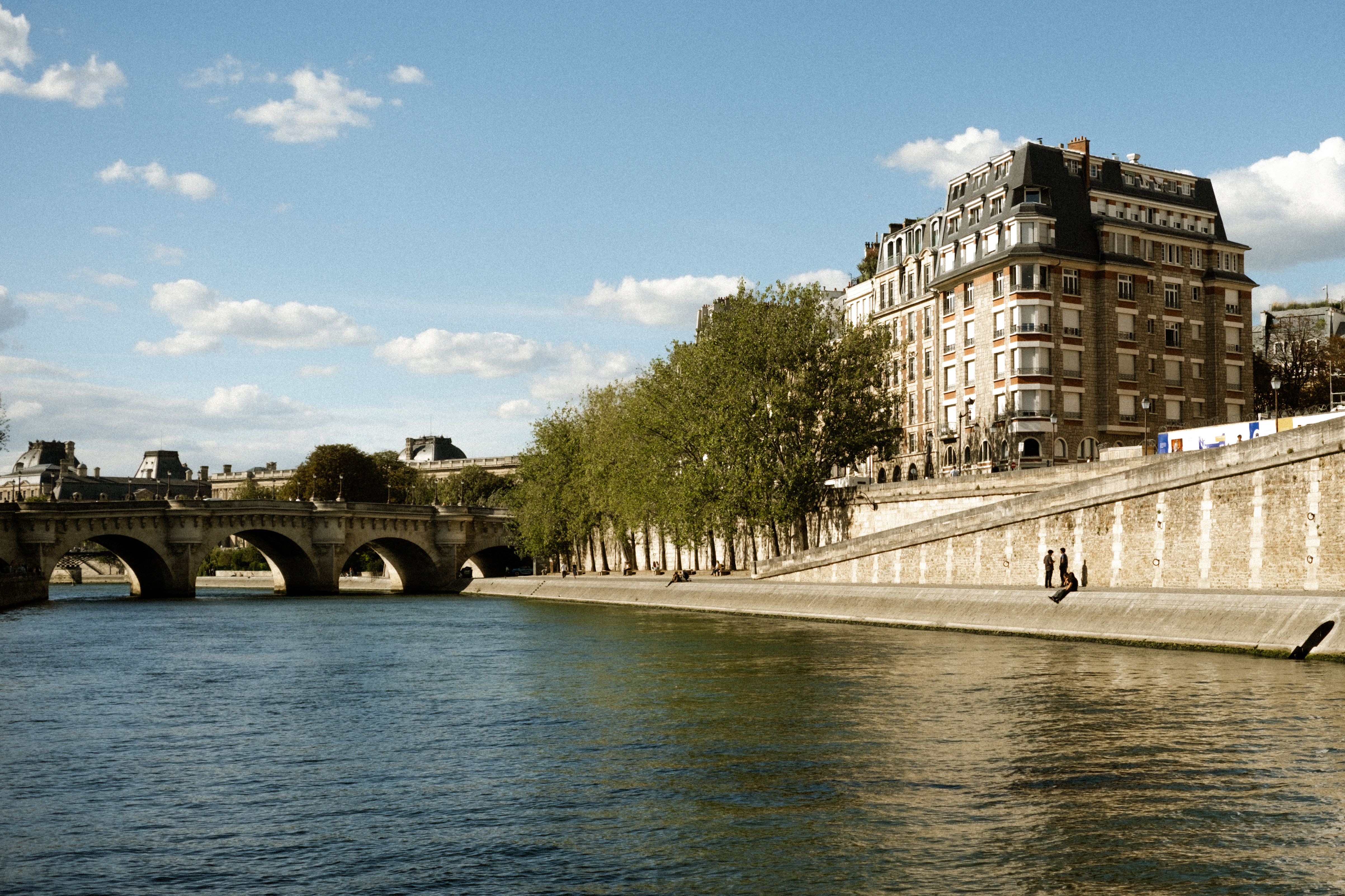 Classic Paris Riverfront Scene with Bridge · Free Stock Photo