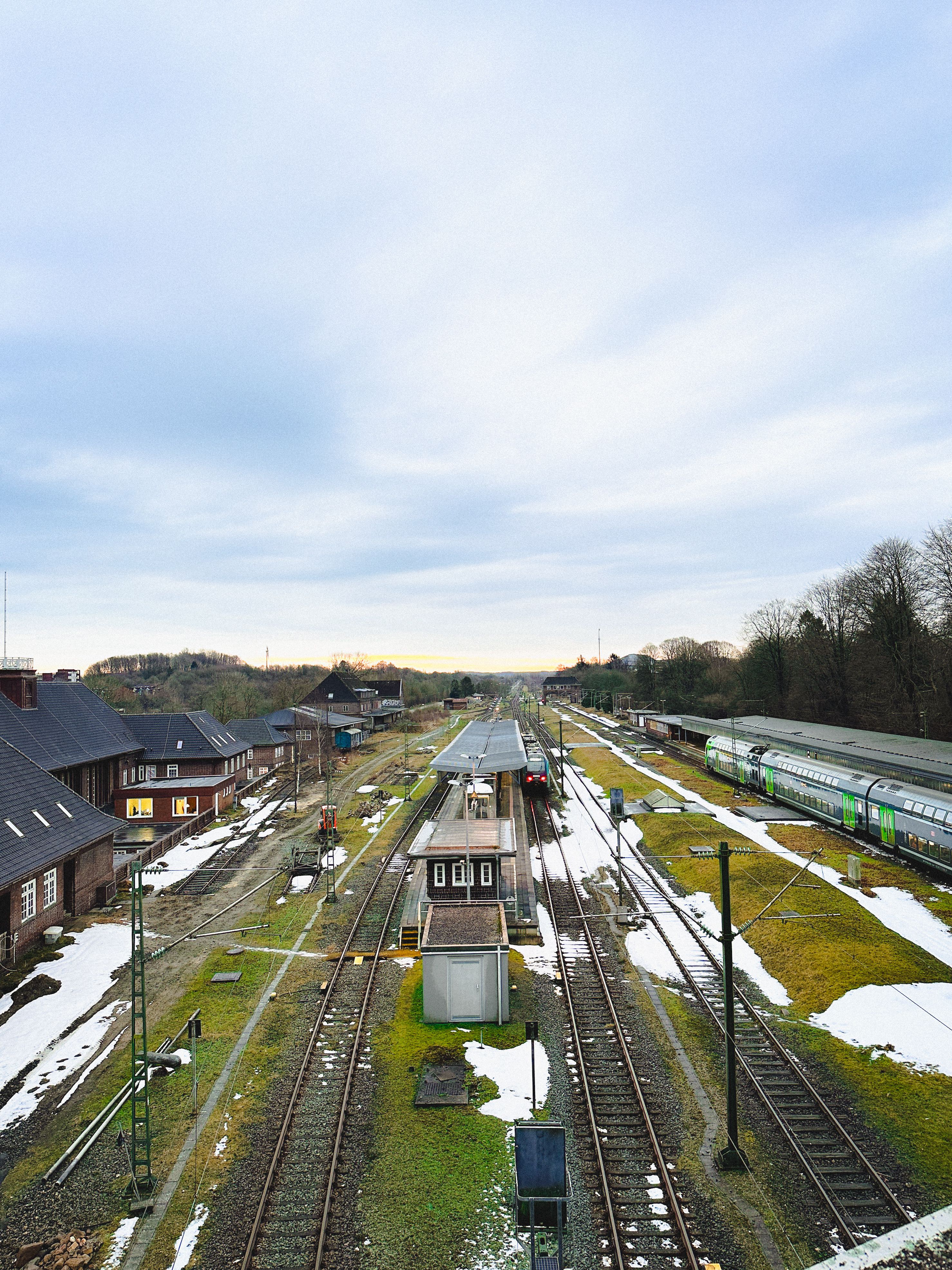 Aerial View of Snowy Train Tracks in Winter · Free Stock Photo