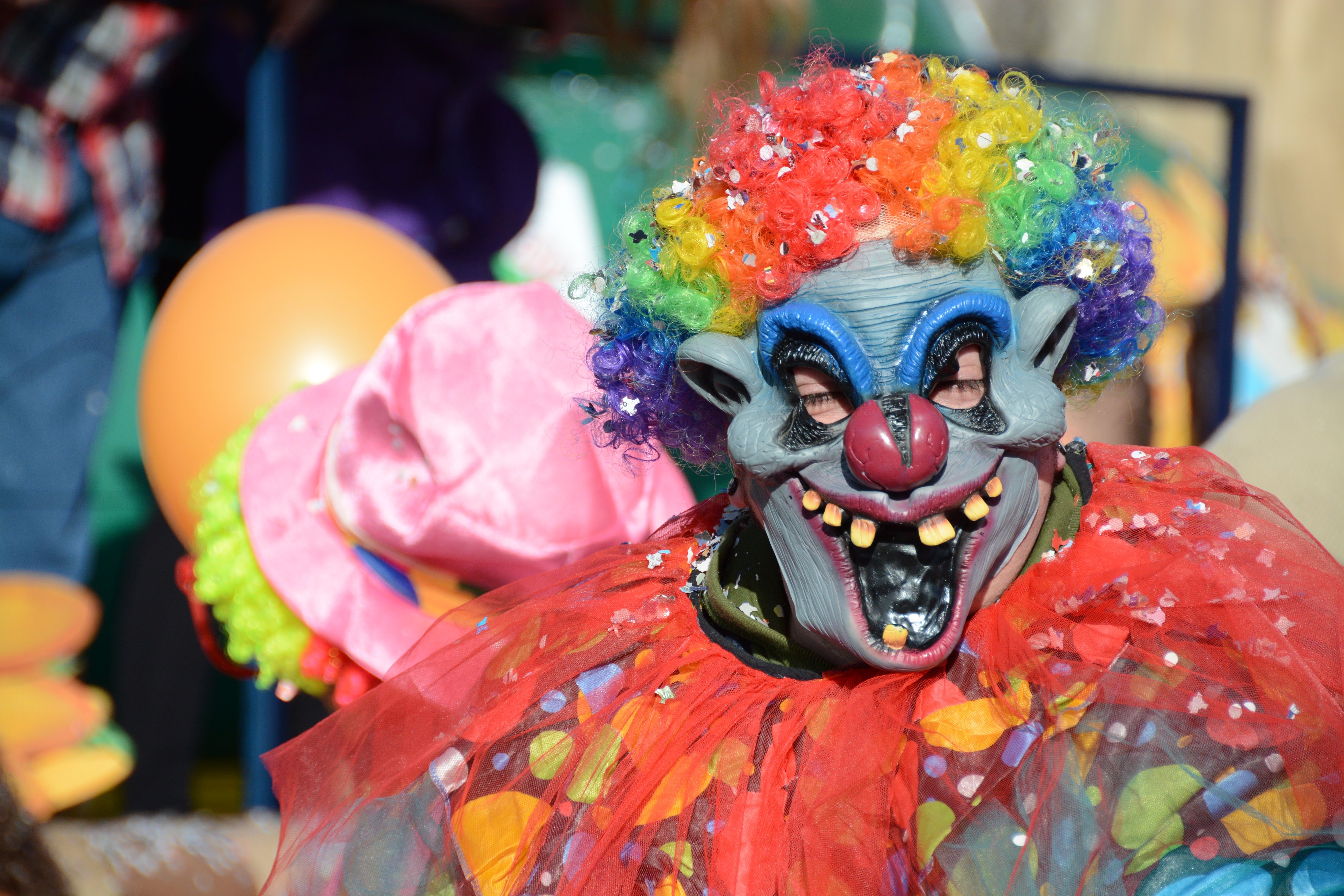 Colorful Clown at Outdoor Carnival Parade · Free Stock Photo