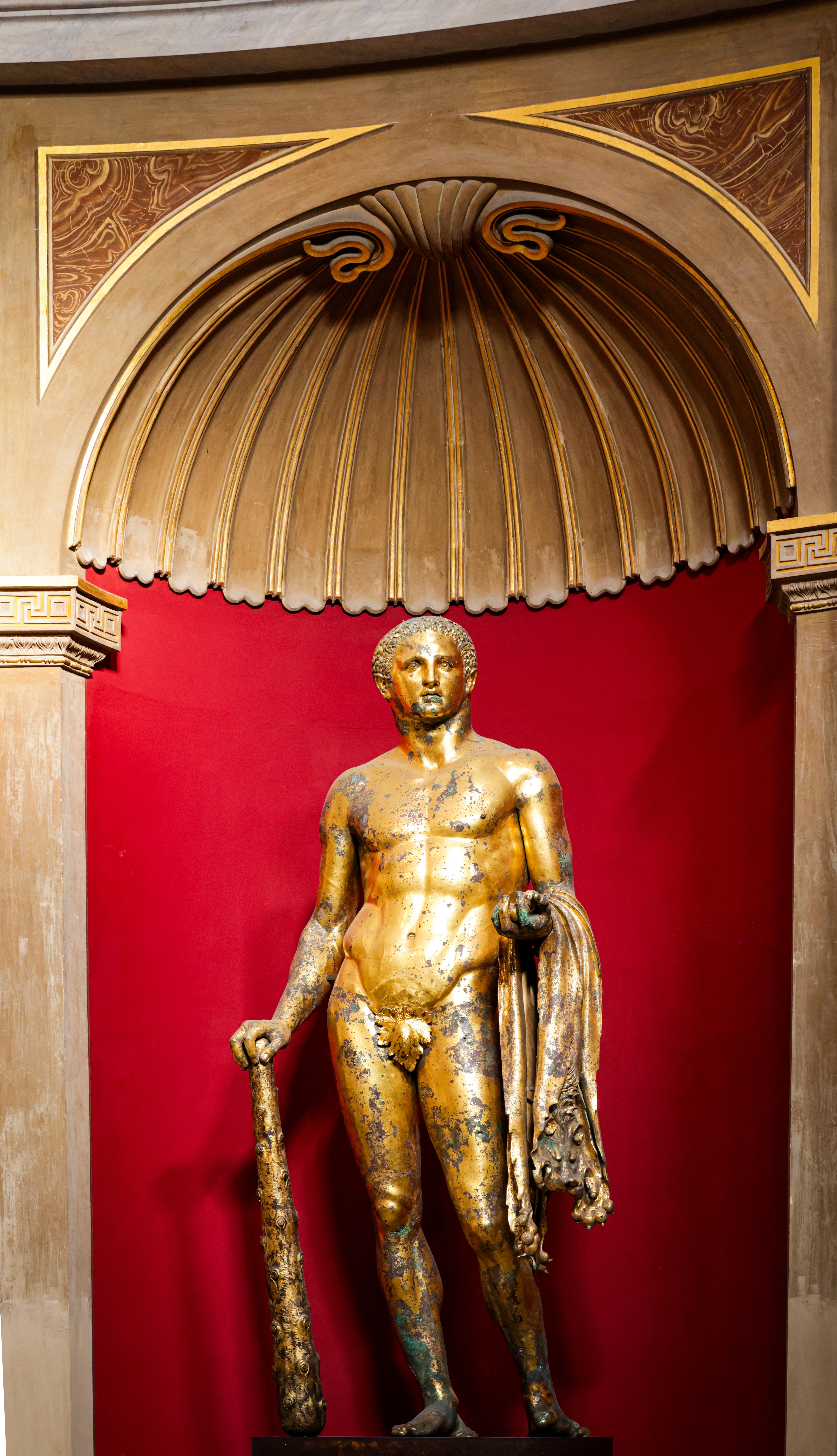 Golden Roman Statue in Classical Niche · Free Stock Photo