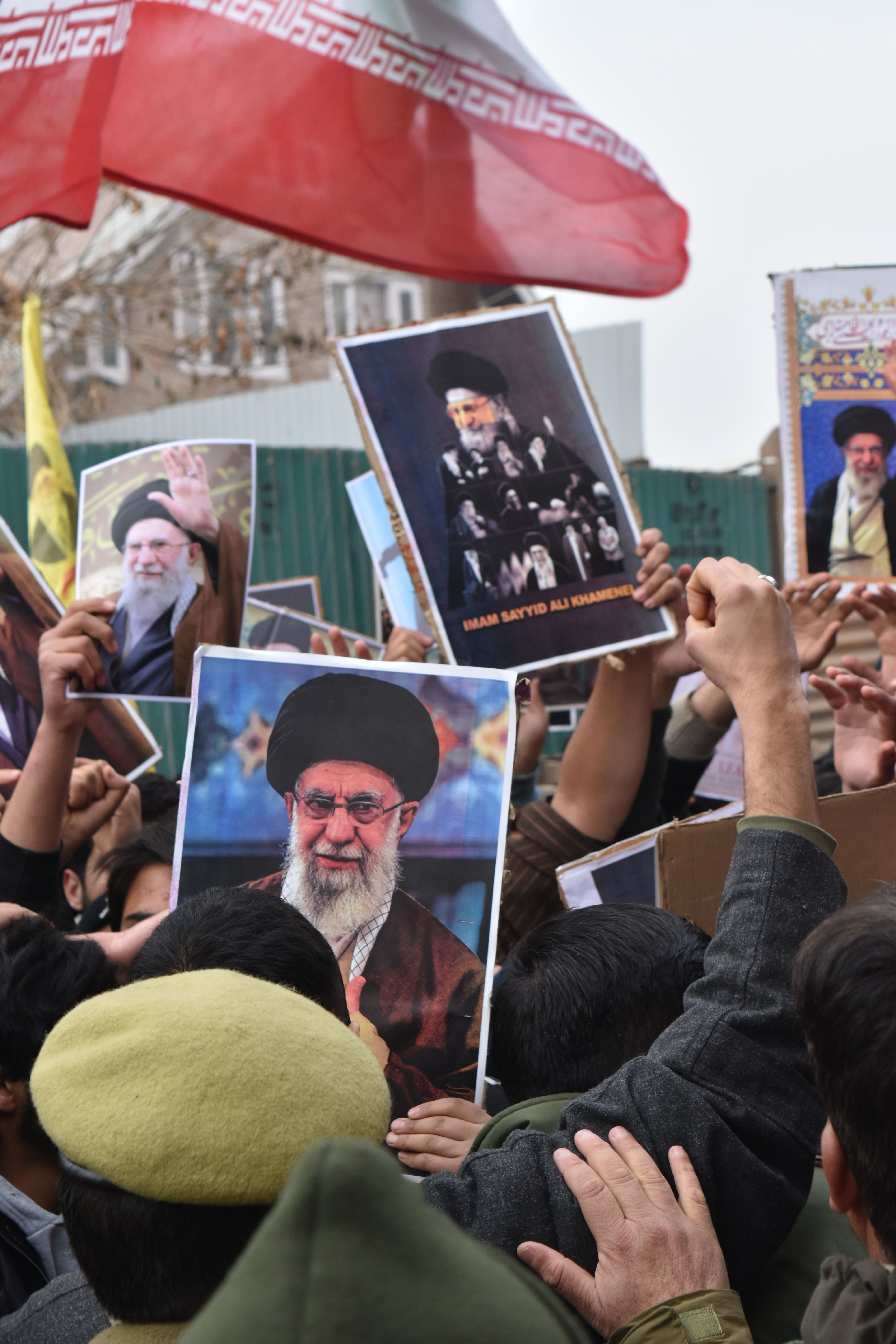 Crowd Holding Iranian Leadership Posters in Protest · Free Stock Photo
