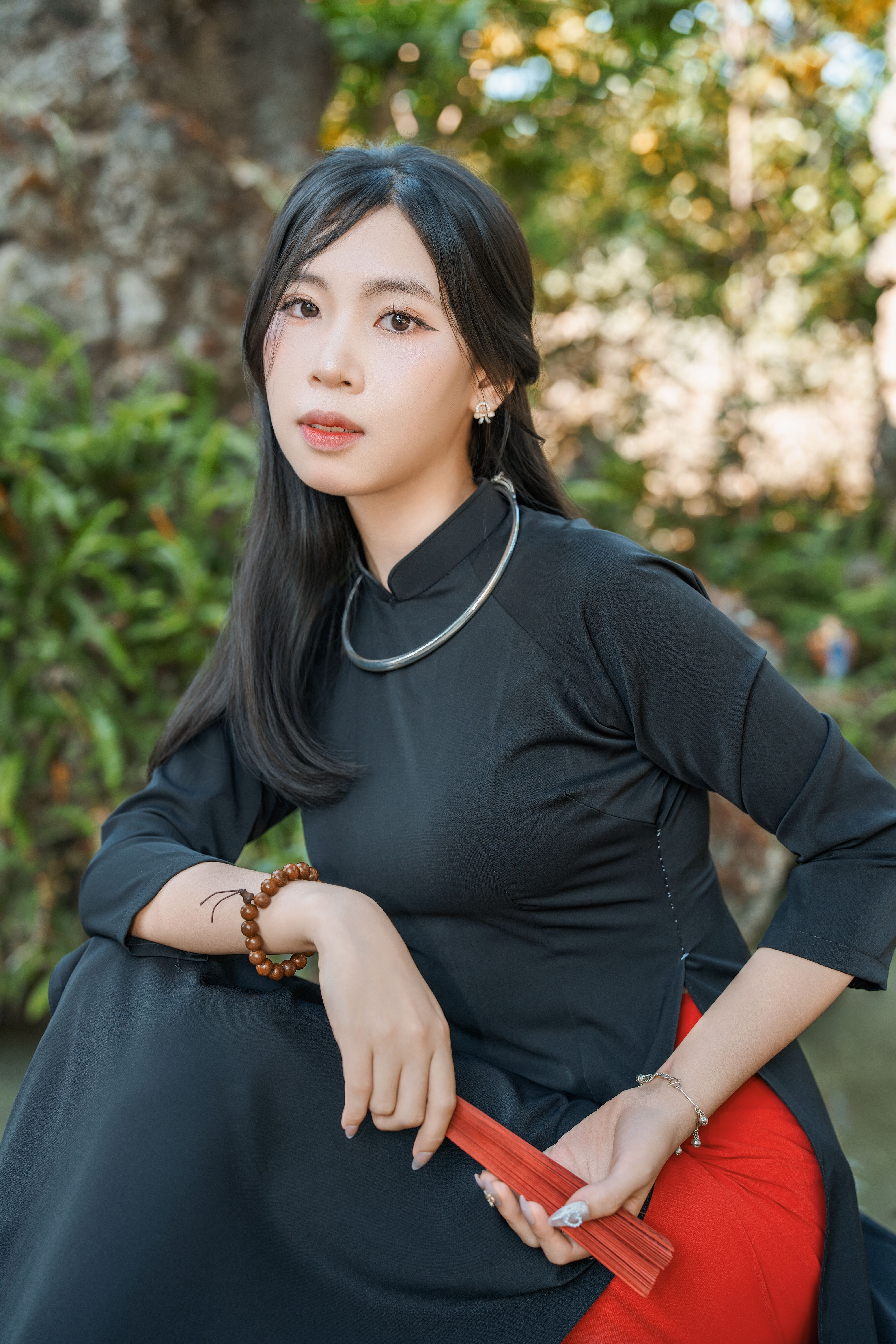 Woman in Traditional Outfit with Red Fan · Free Stock Photo