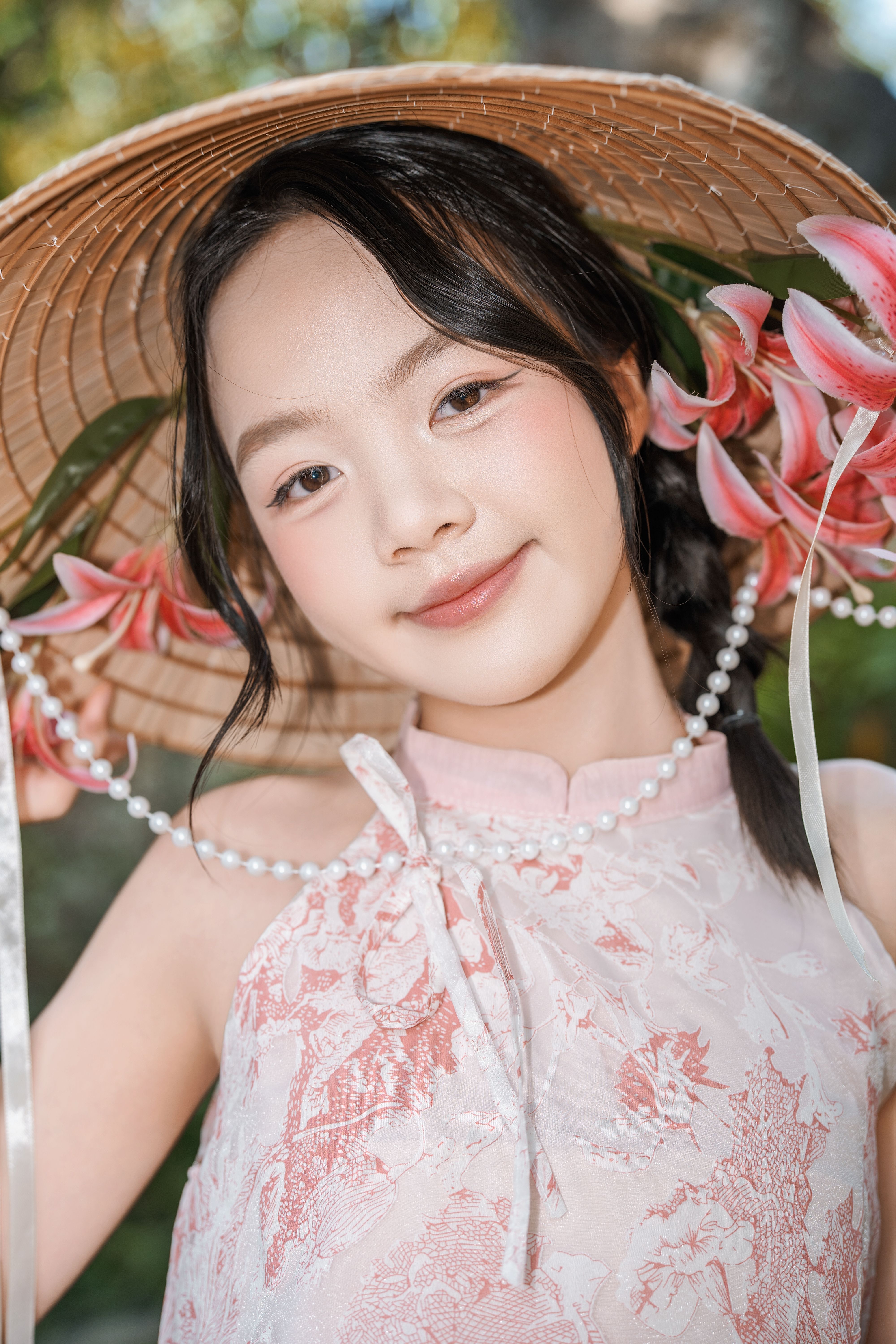 Portrait of a Young Girl with Floral Hat Outdoors · Free Stock Photo