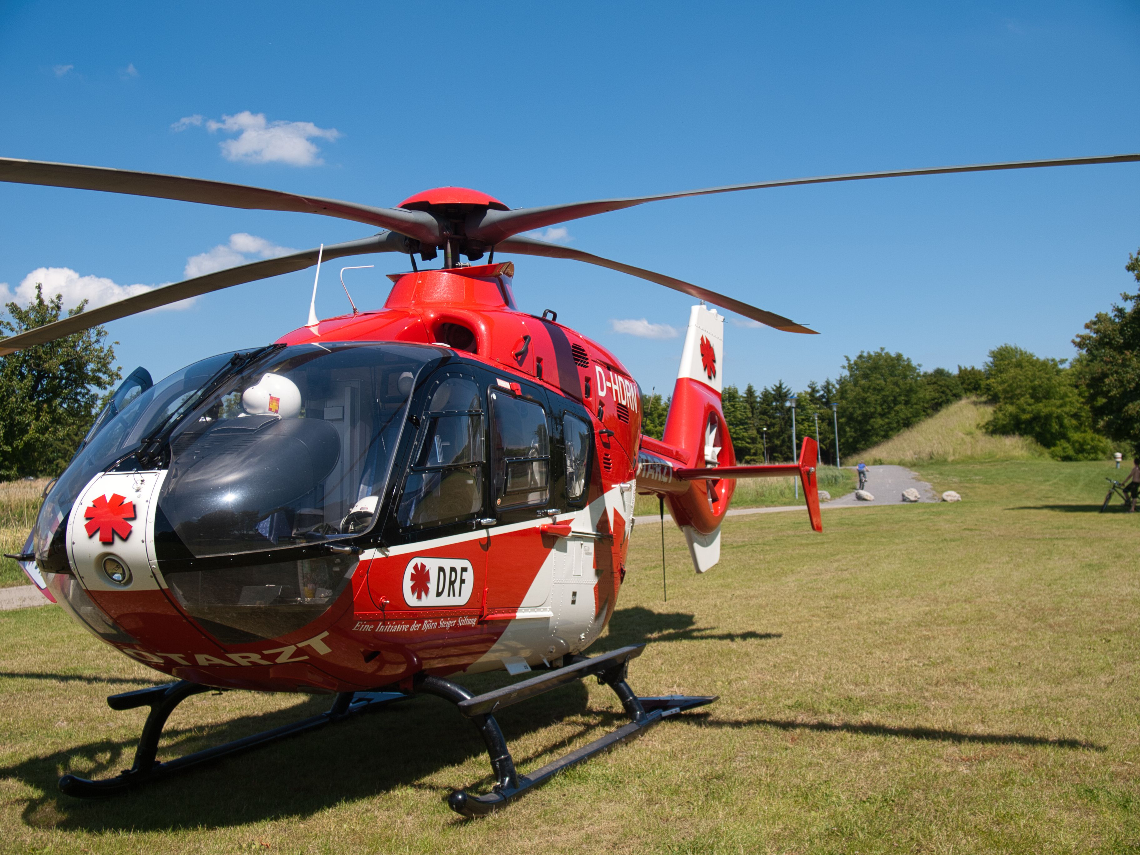 Red Emergency Rescue Helicopter on a Field · Free Stock Photo