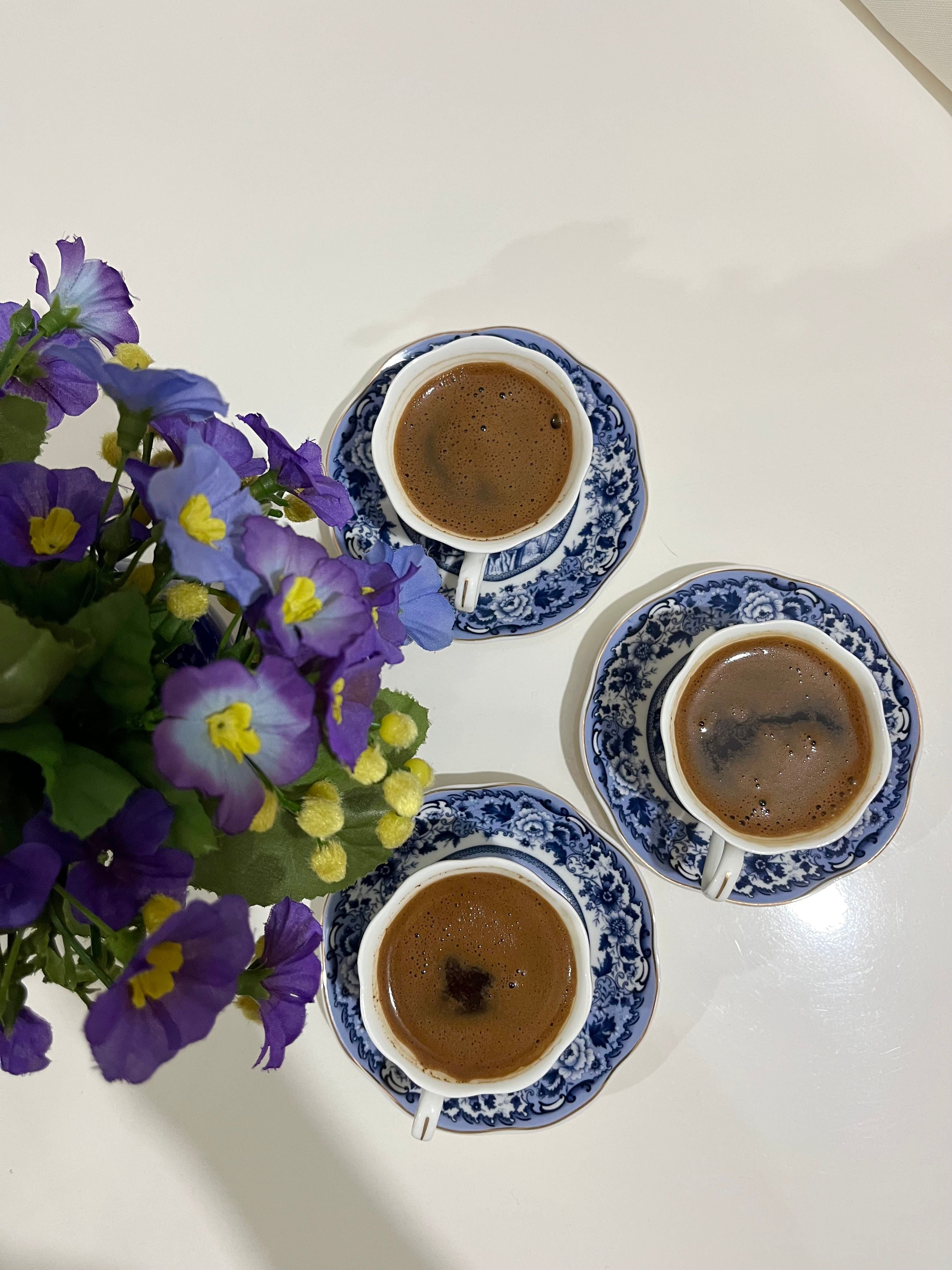 Elegant Coffee Setting with Floral Accent · Free Stock Photo