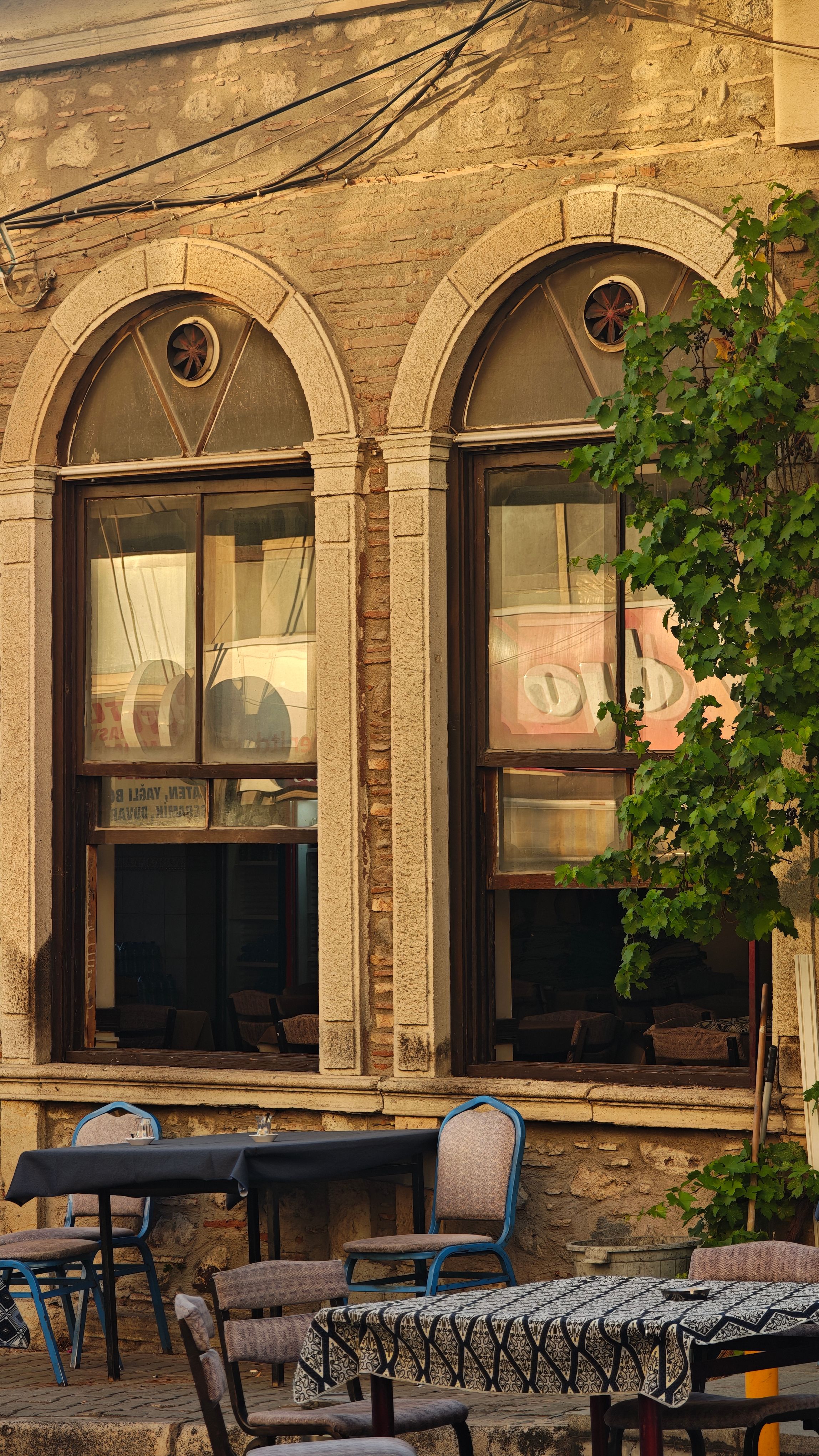 Historic Cafe Exterior with Arched Windows · Free Stock Photo
