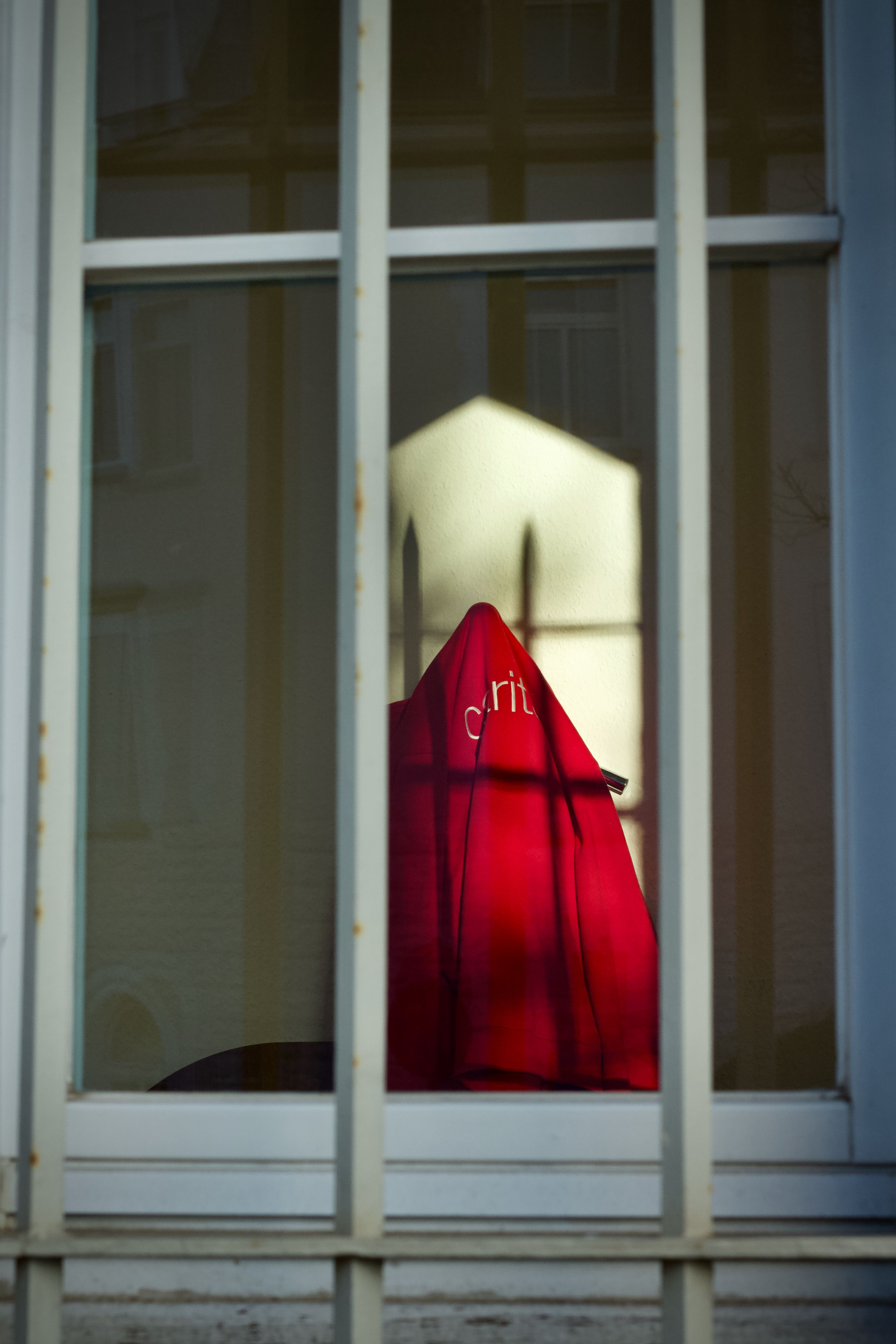 Mysterious Red Fabric Behind Window Frame · Free Stock Photo