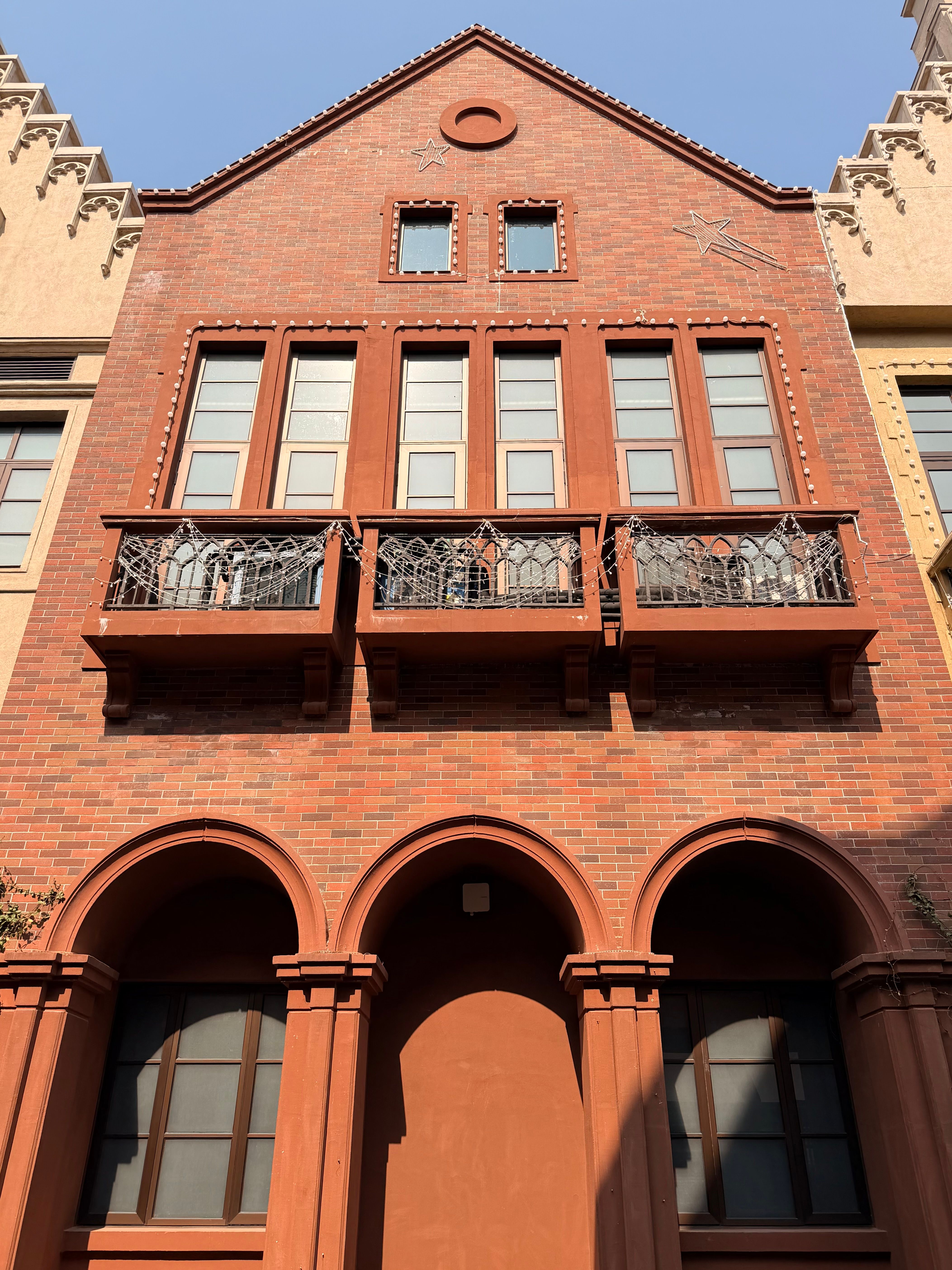 Historic Brick Building with Arched Windows · Free Stock Photo