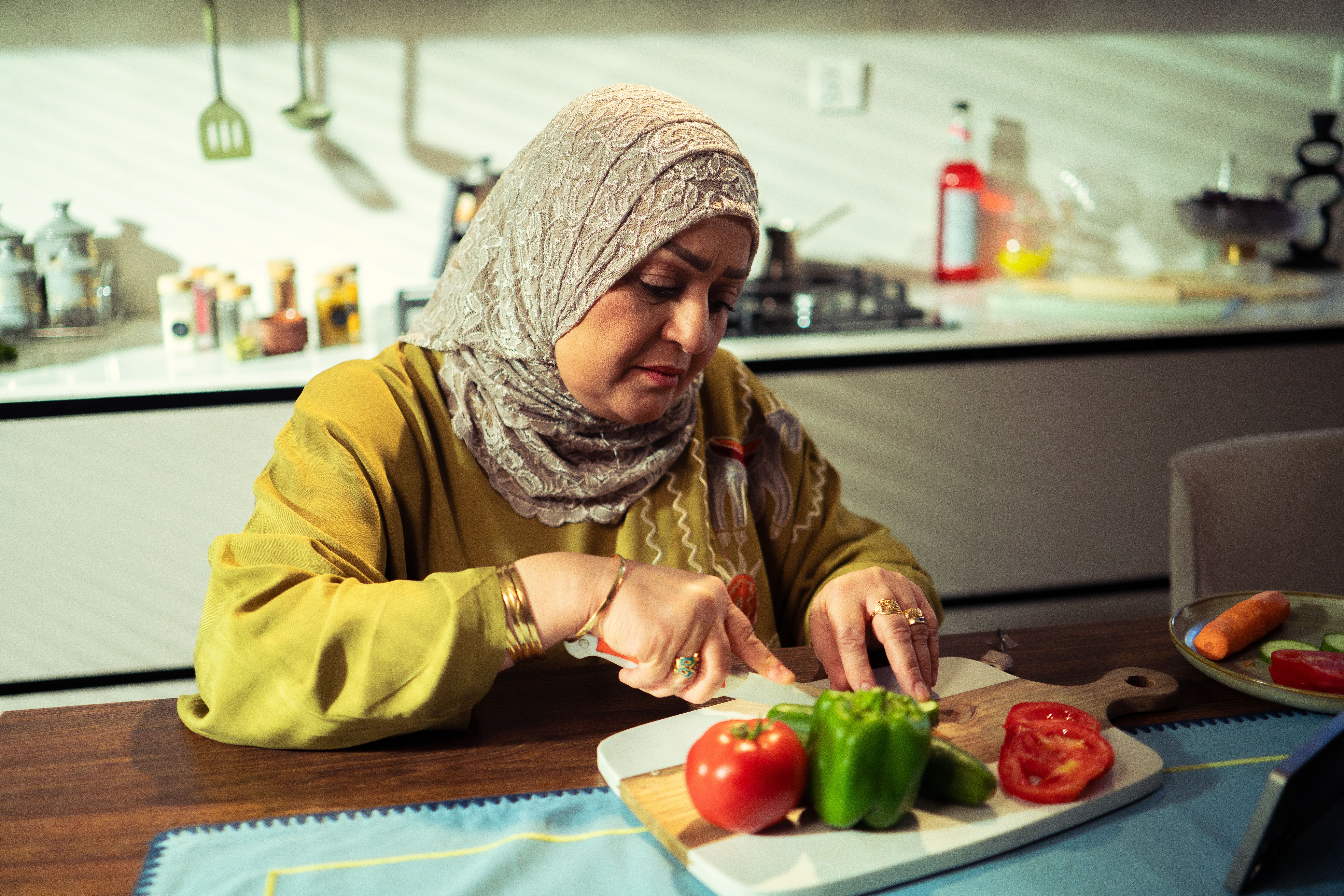 Middle Eastern Woman Cooking with Fresh Vegetables · Free Stock Photo