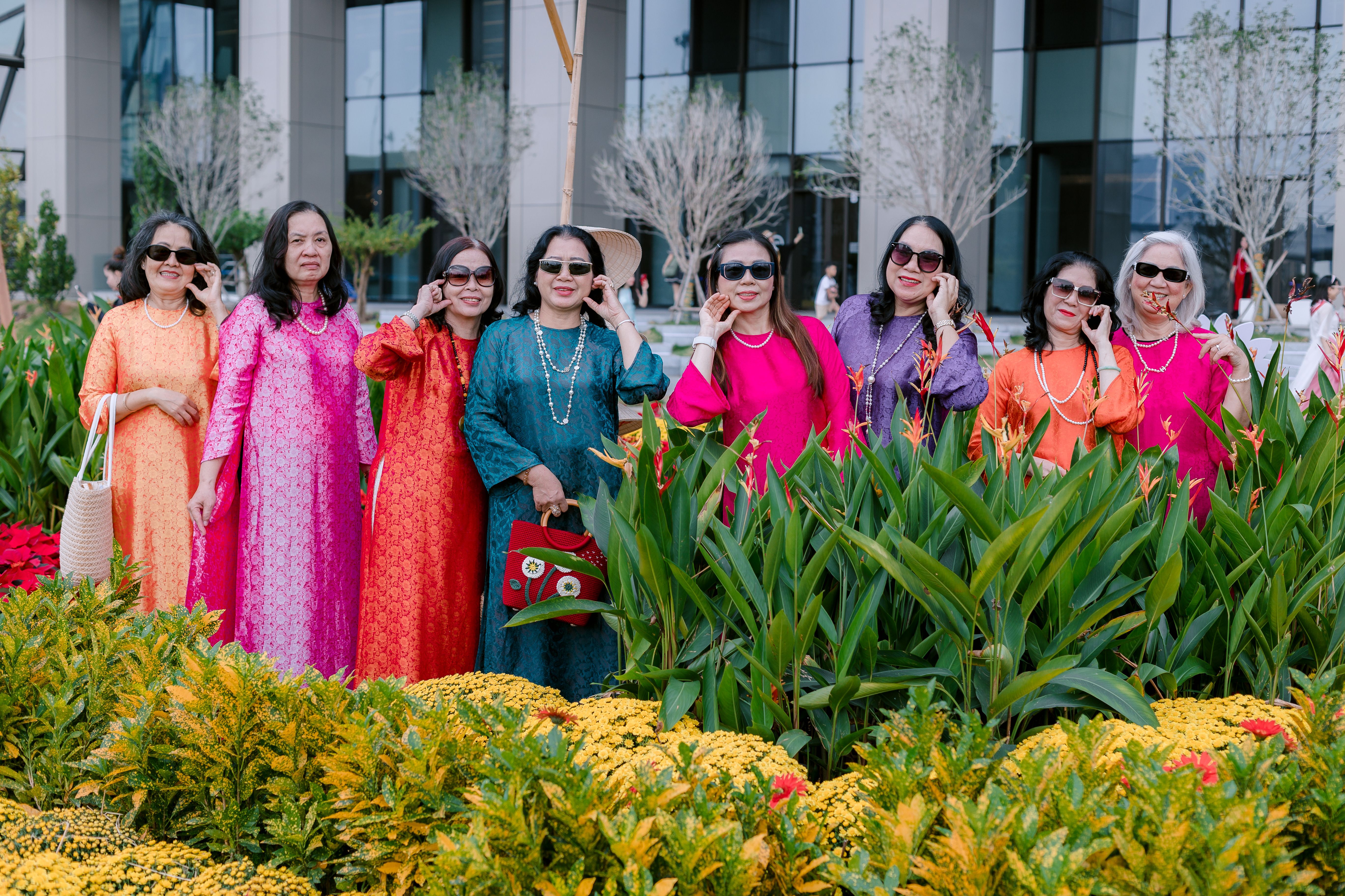 Colorful Group of Women in Vibrant Traditional Attire · Free Stock Photo