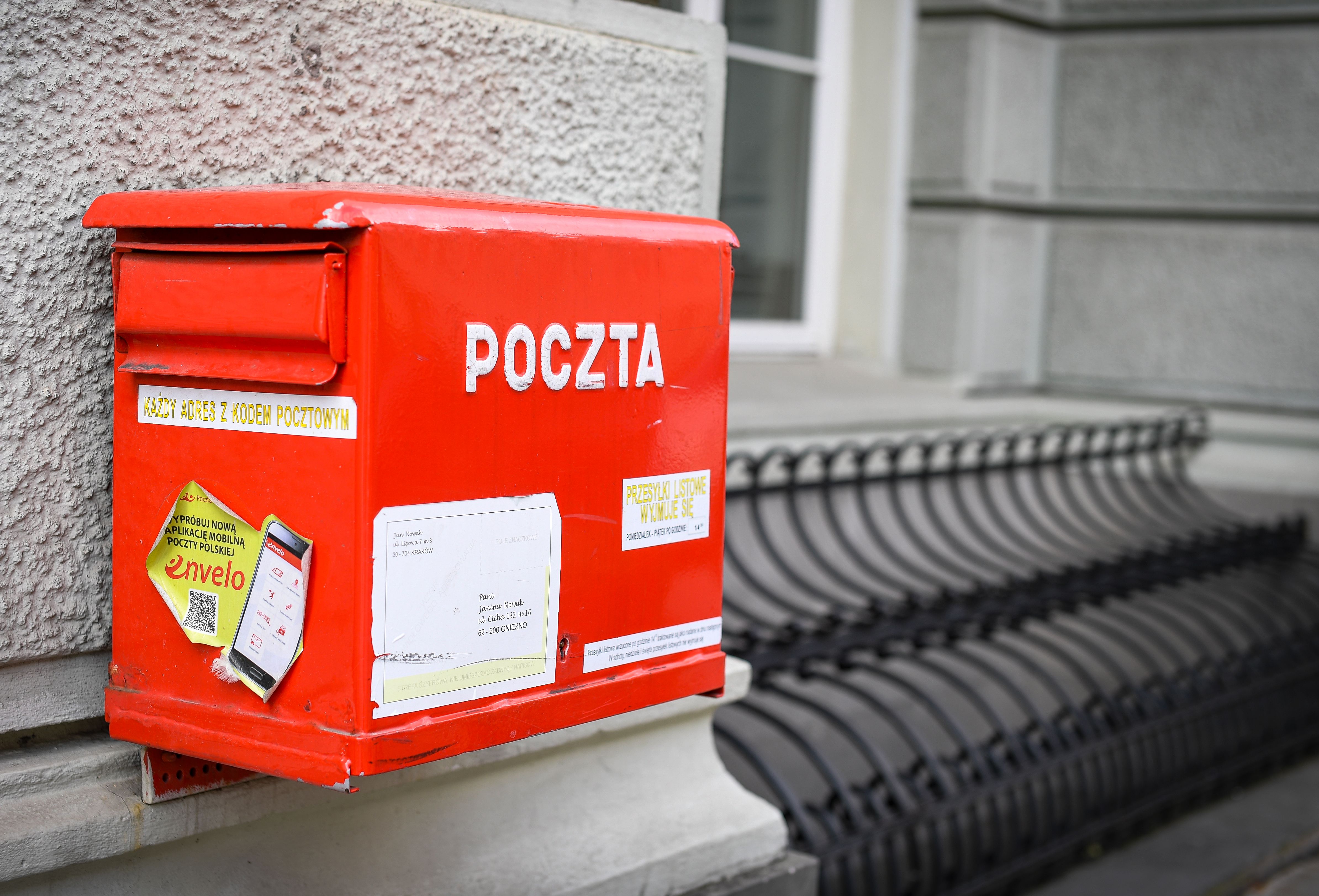 Red Polish Mailbox on Historic Street in Warsaw · Free Stock Photo