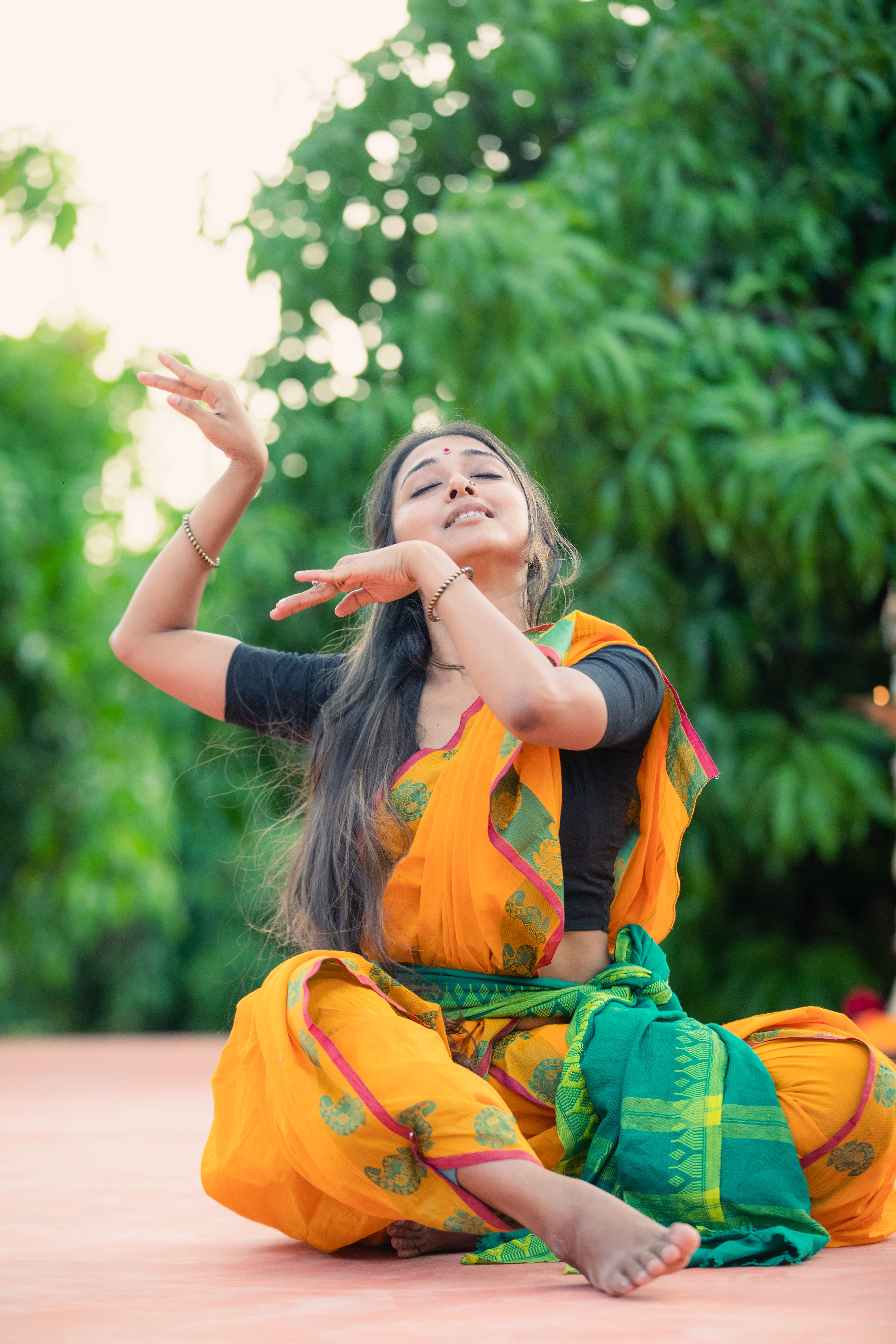 Elegant Traditional Dance in Vibrant Saree Outdoors · Free Stock Photo