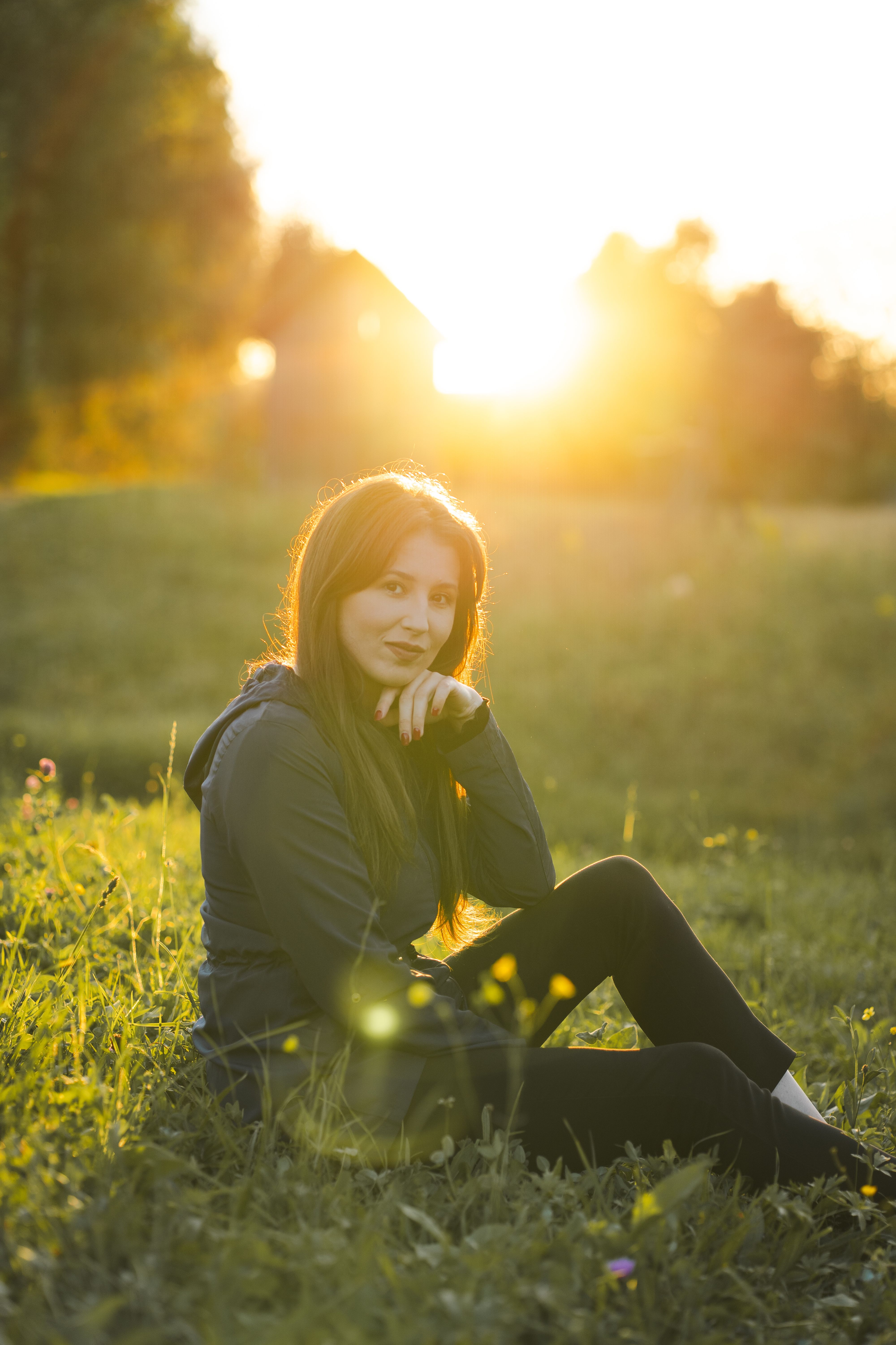 Serene Portrait of a Woman at Golden Hour Sunset · Free Stock Photo