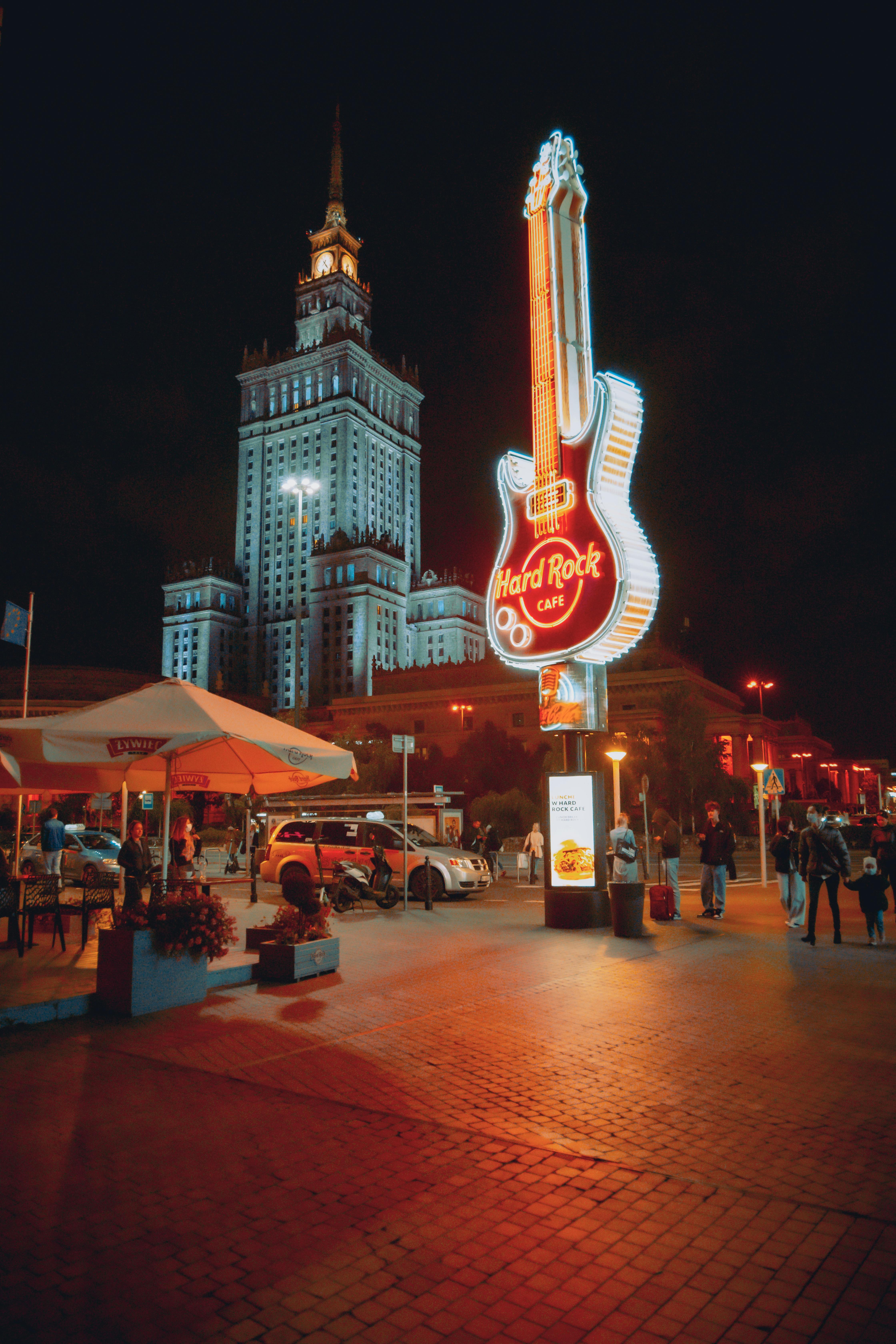 Hard Rock Cafe Sign with Palace of Culture in Warsaw Nightscape · Free ...