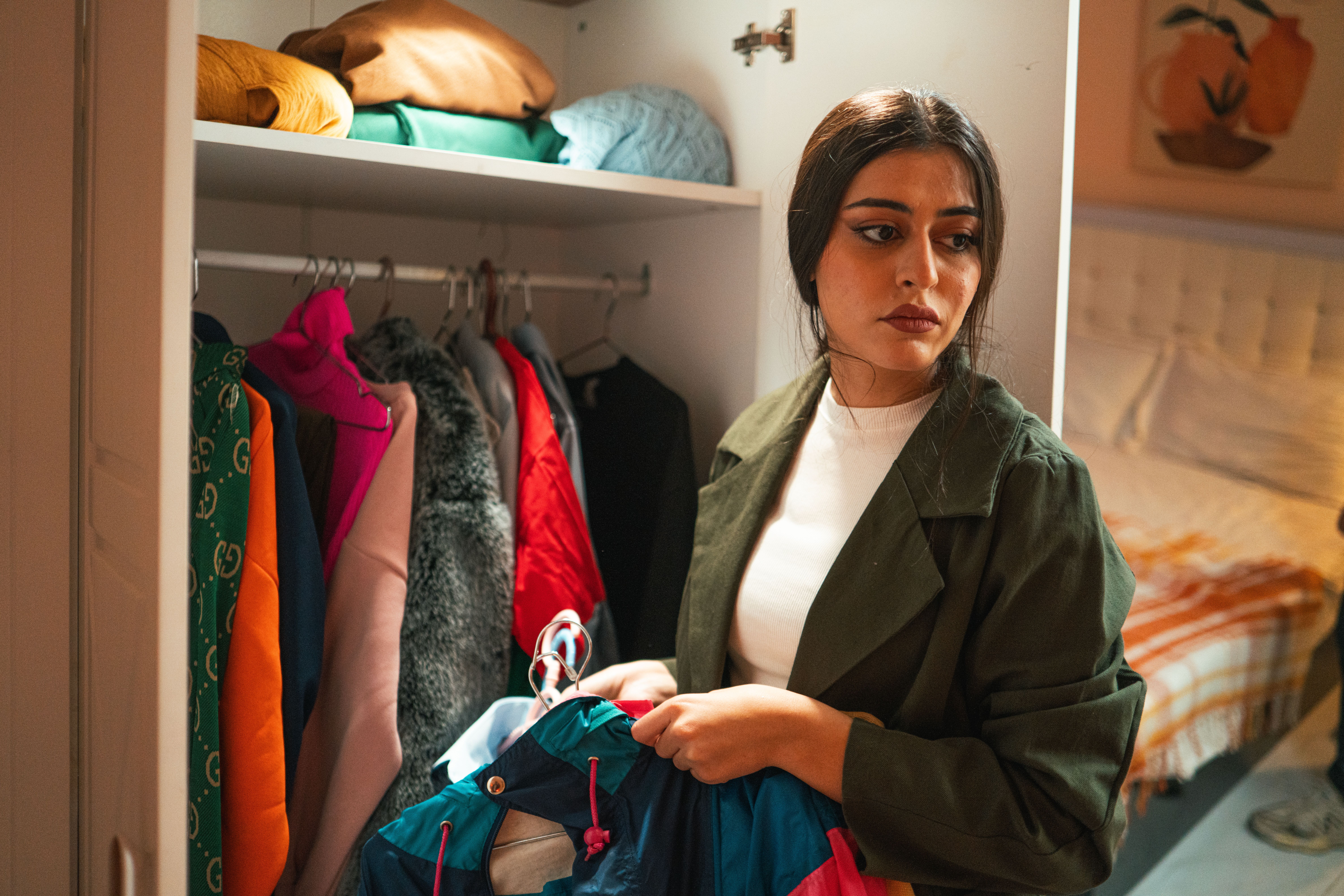 Woman Organizing Wardrobe in Bedroom · Free Stock Photo