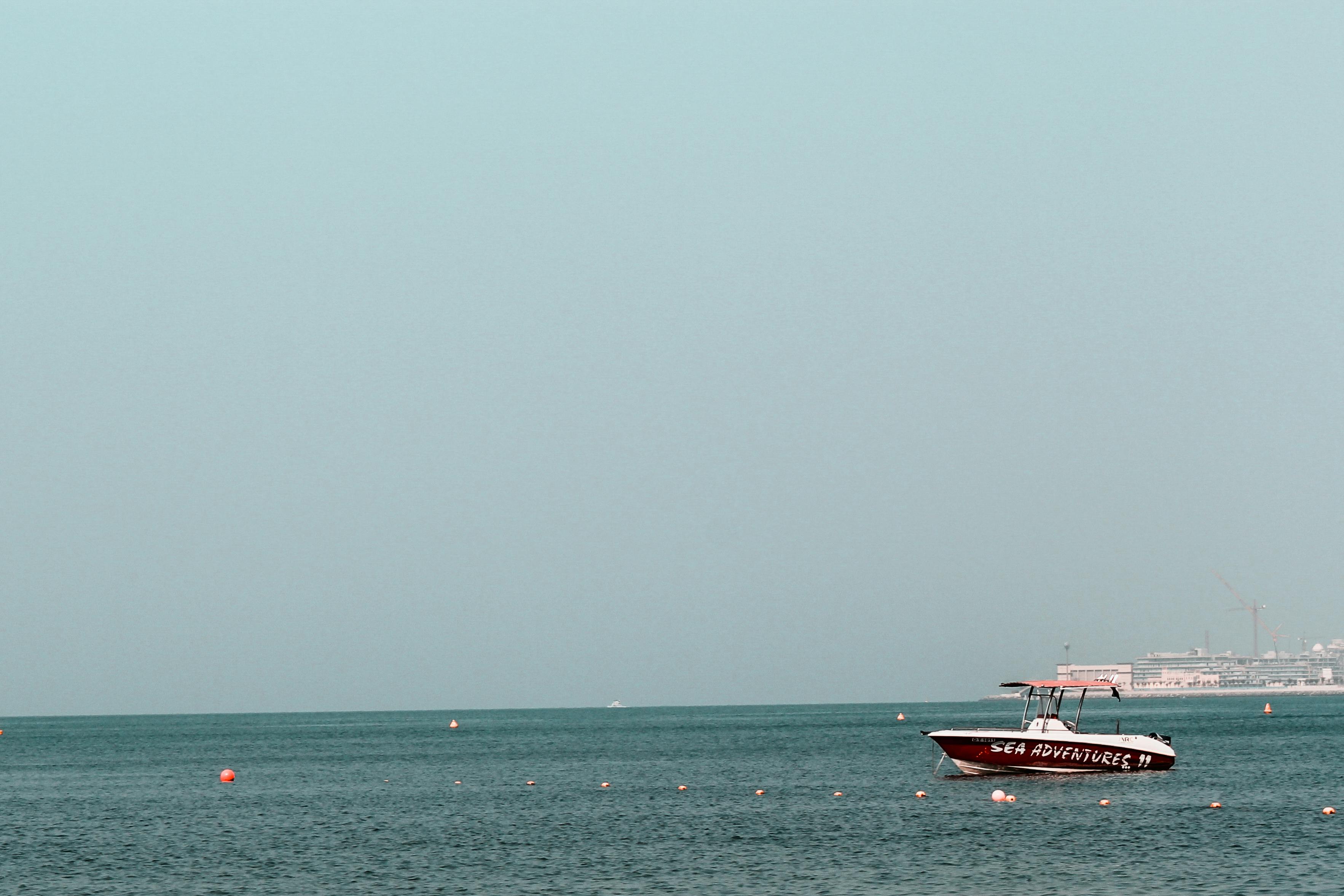 Fishermen Pushing Boat into Sea · Free Stock Photo