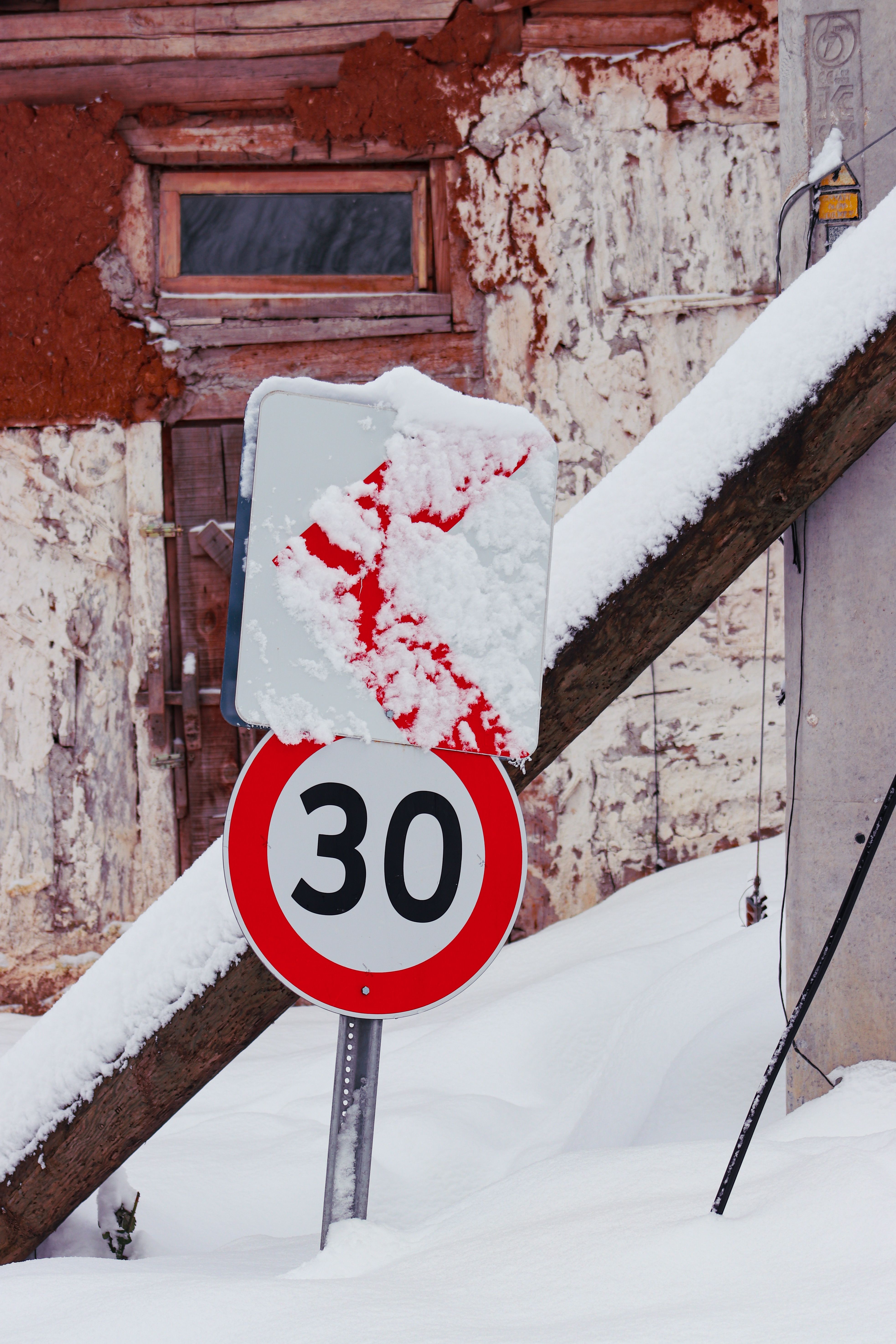 Snow-Covered Road Signs in Winter · Free Stock Photo