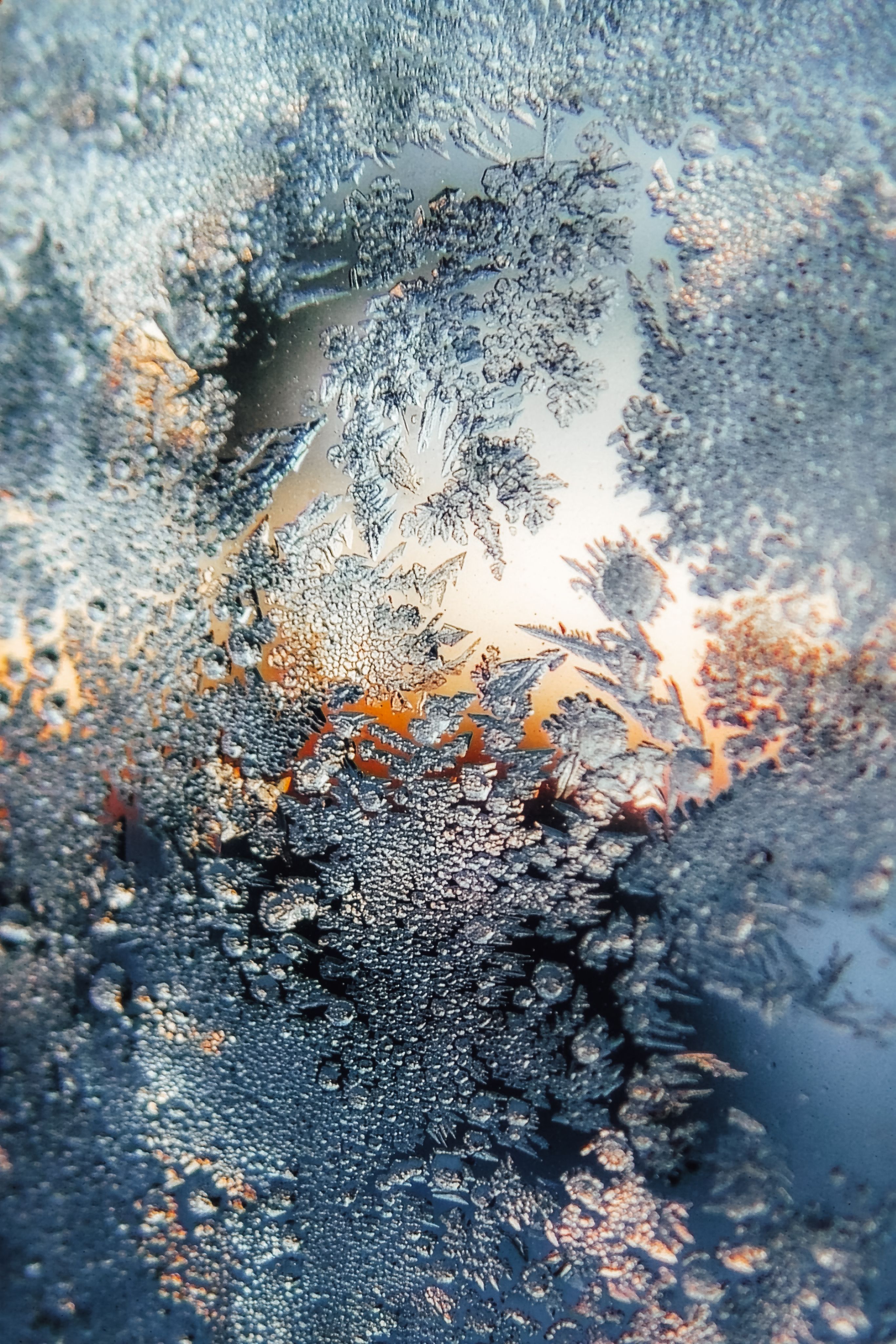 Beautiful Frosty Patterns on Window at Dawn · Free Stock Photo
