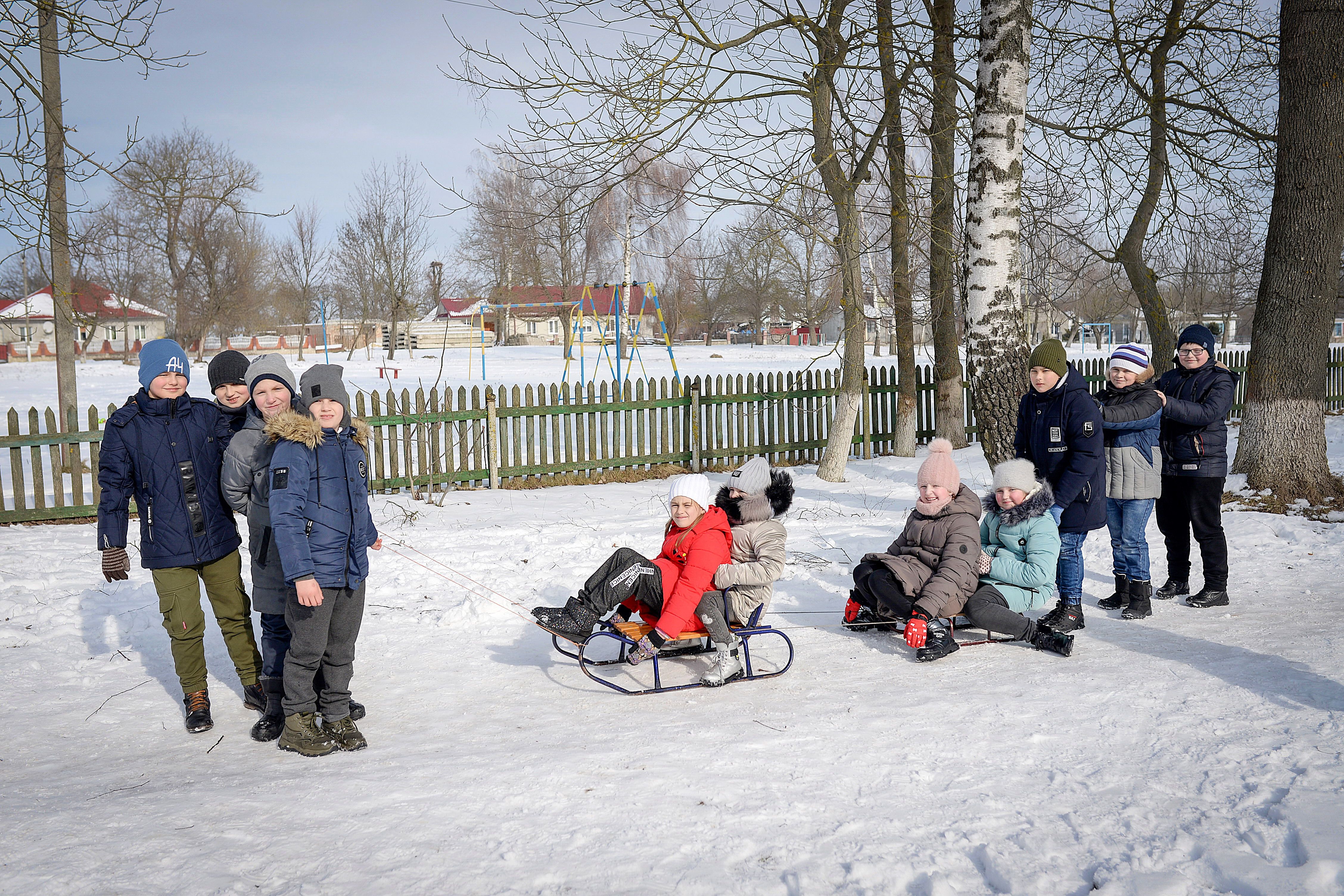 Children Enjoying Winter Sledding Outdoors · Free Stock Photo