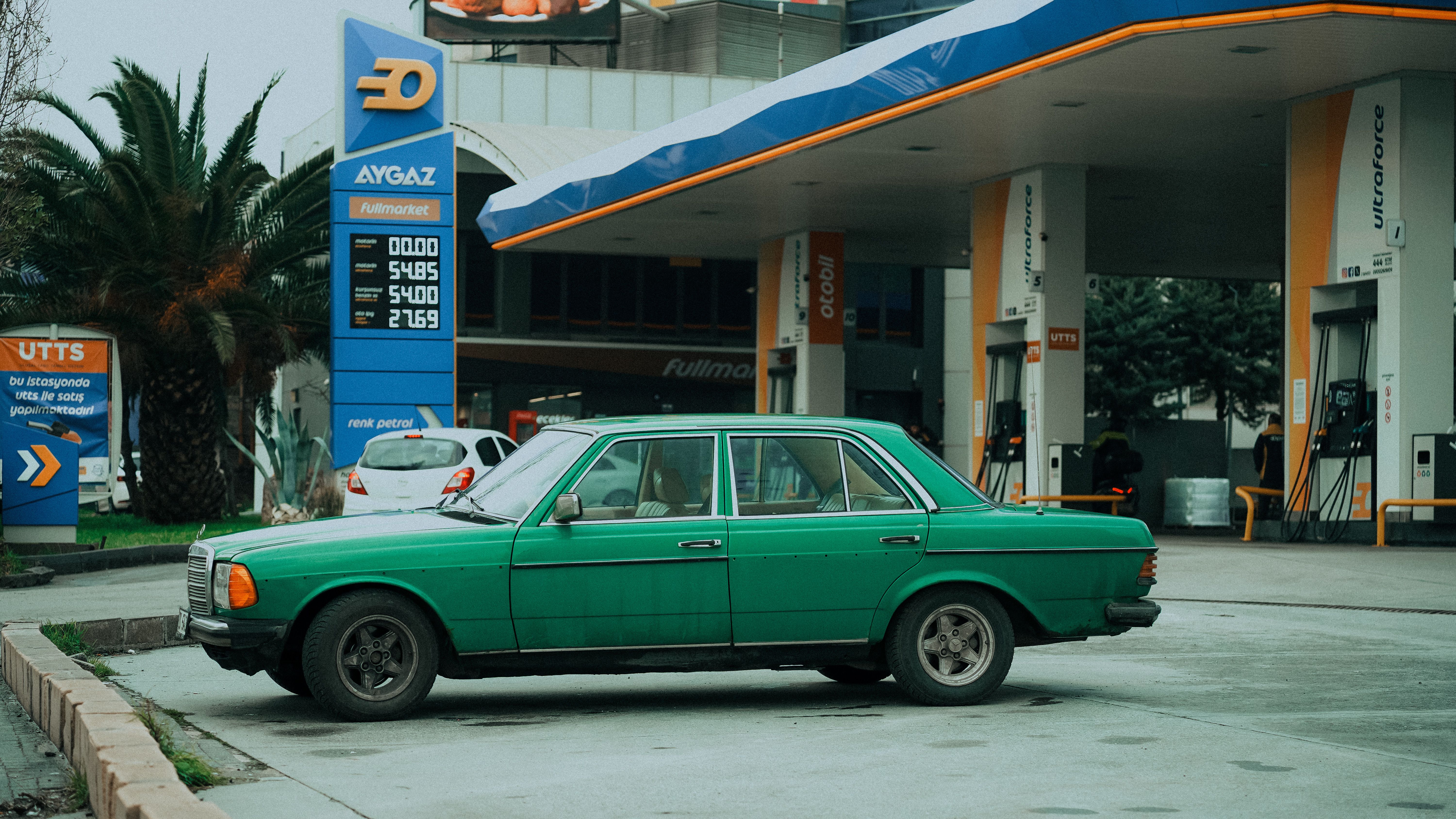 Vintage Green Car at Istanbul Gas Station · Free Stock Photo