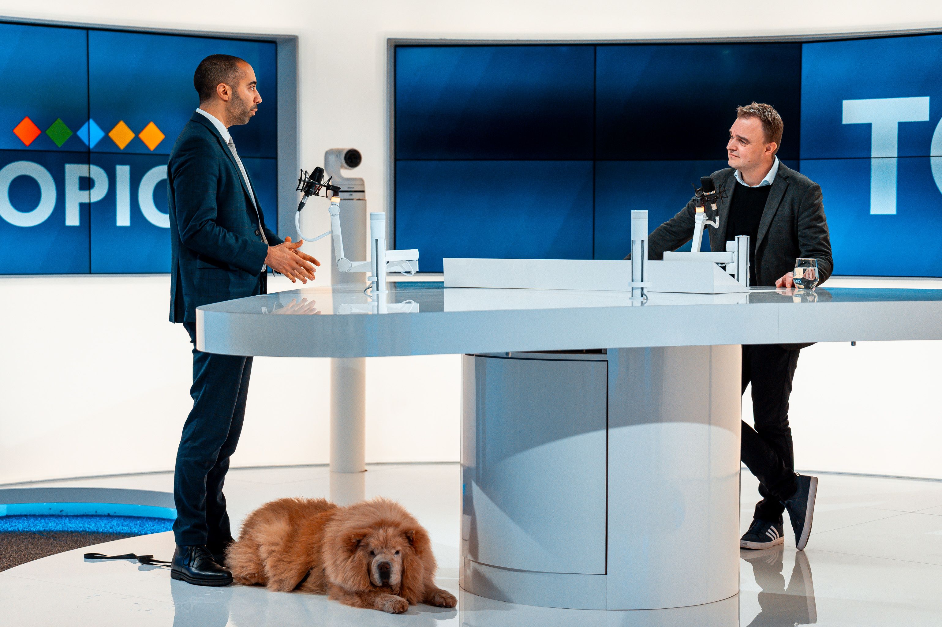 Professional Talk Show with Two Hosts and Dog · Free Stock Photo