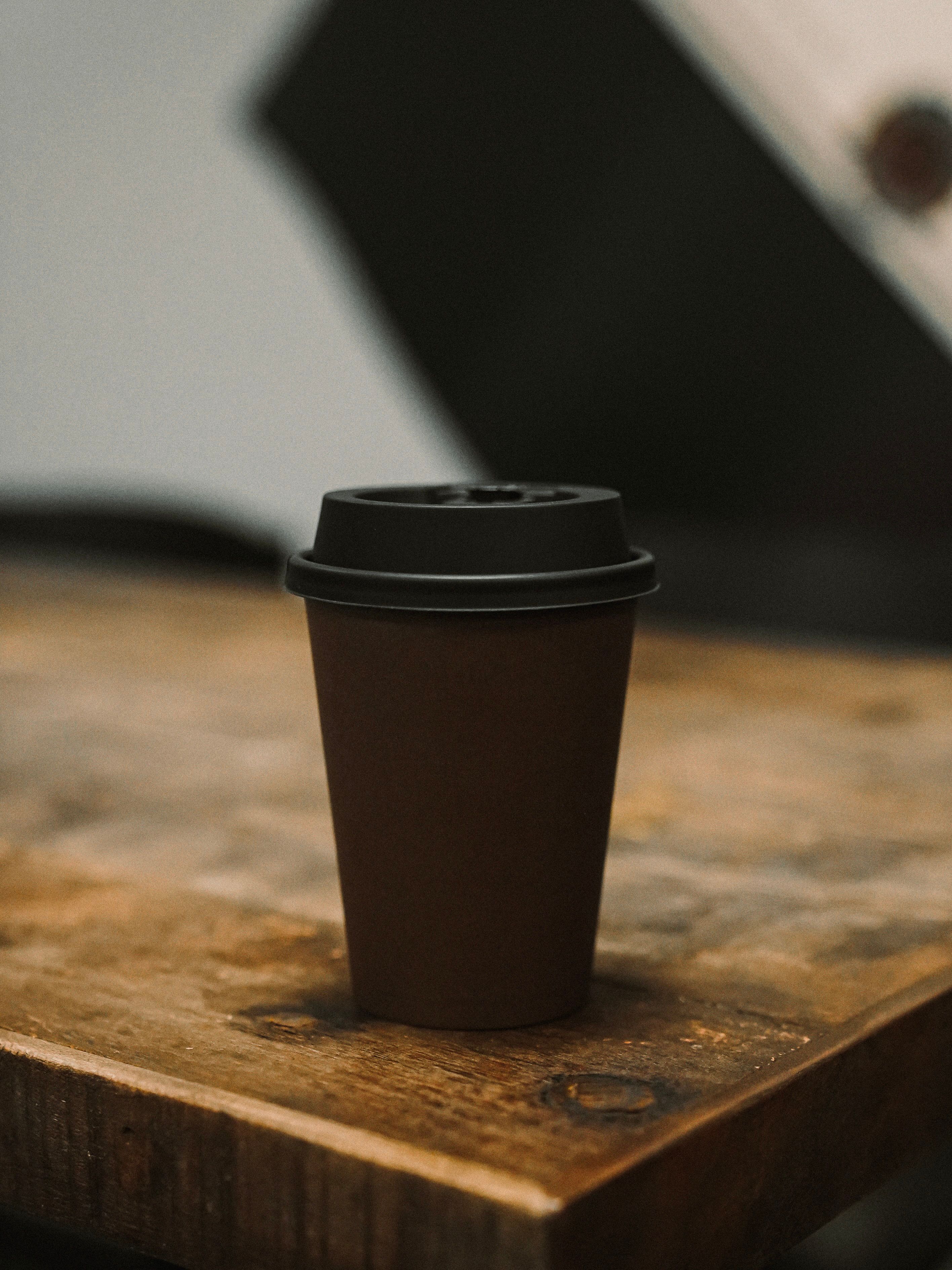 Photo of Coffee Cup on Wooden Surface · Free Stock Photo