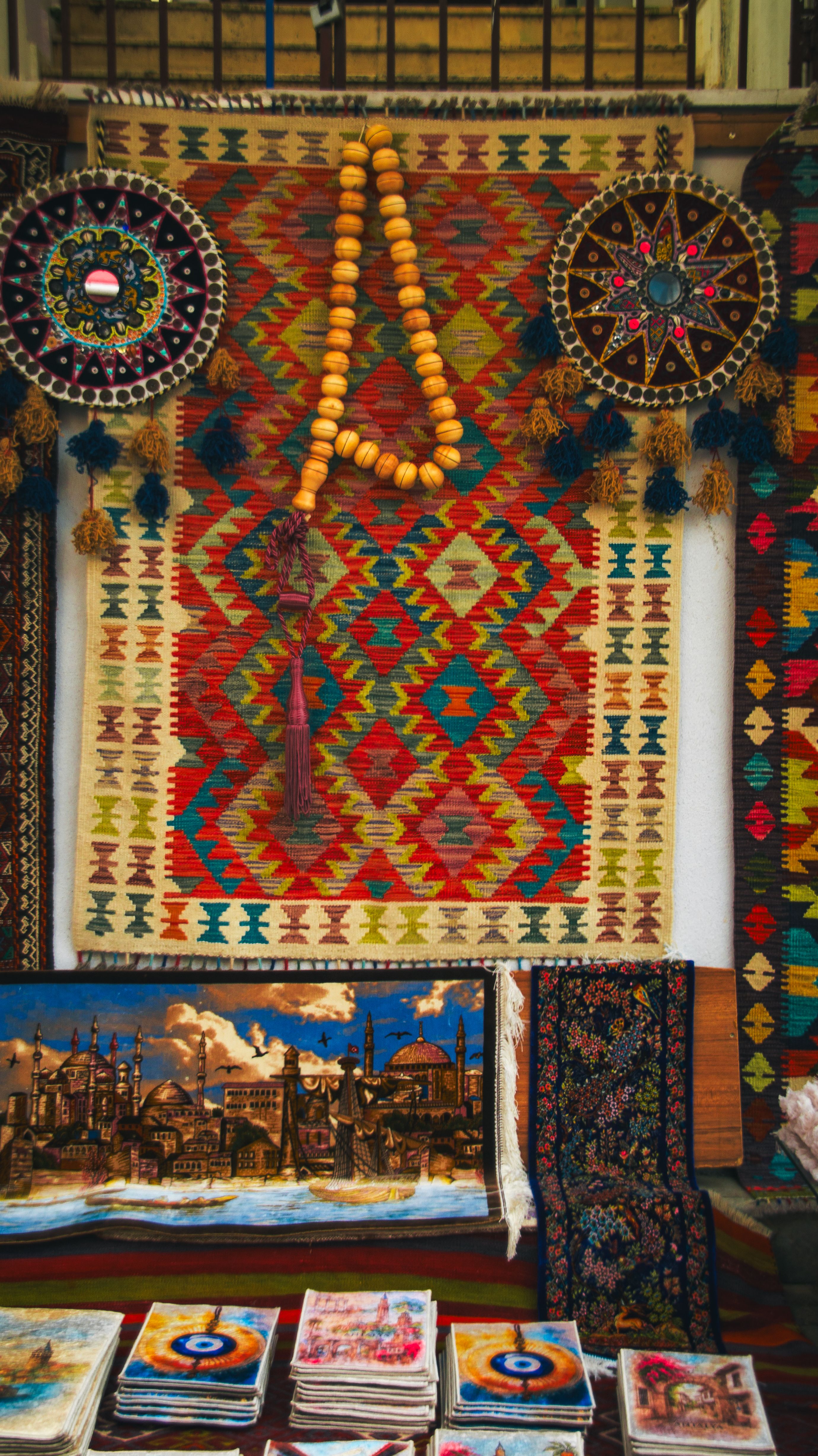 Vibrant Traditional Market Display with Rugs · Free Stock Photo