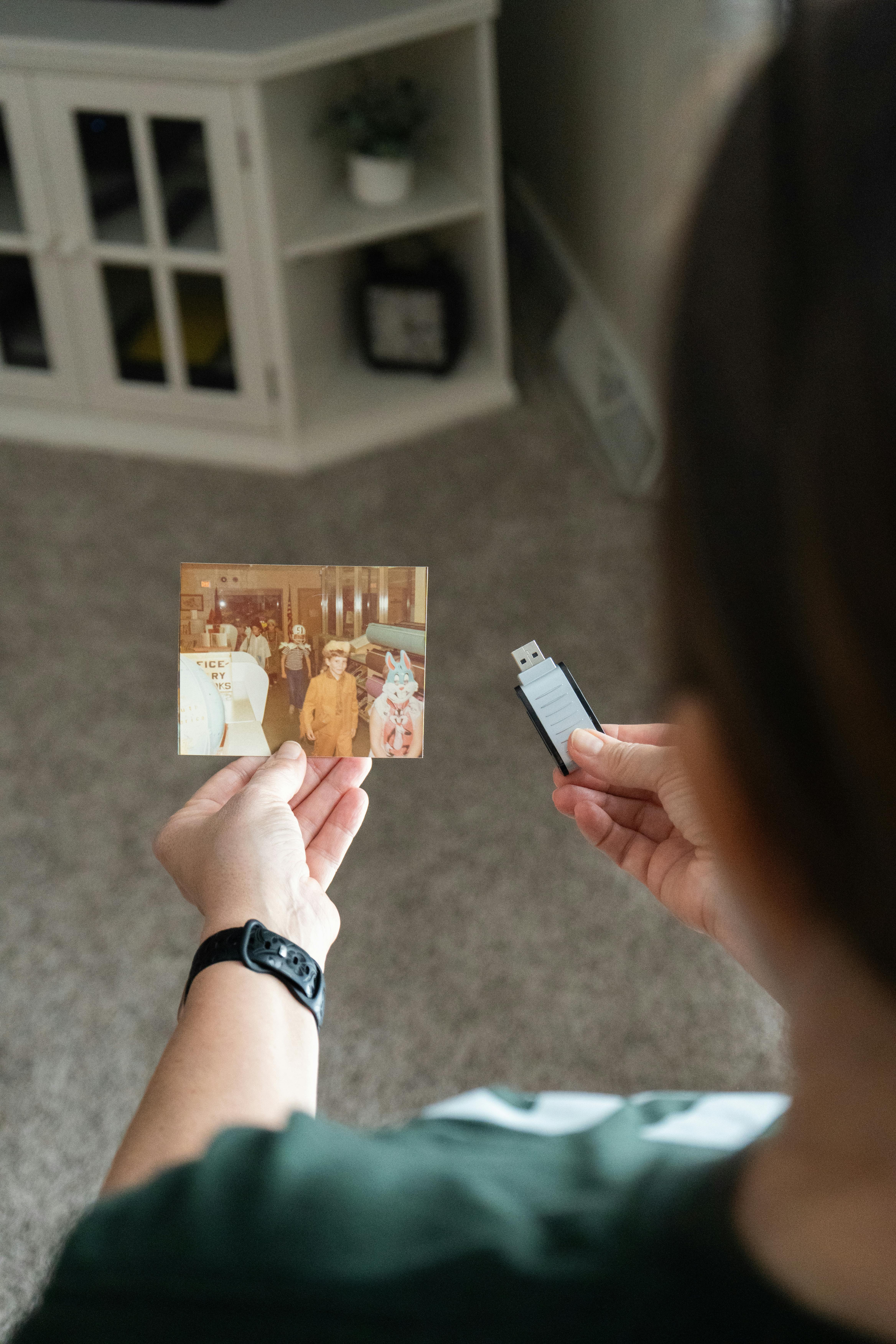 Comparing Vintage Photo with Digital Storage Medium · Free Stock Photo