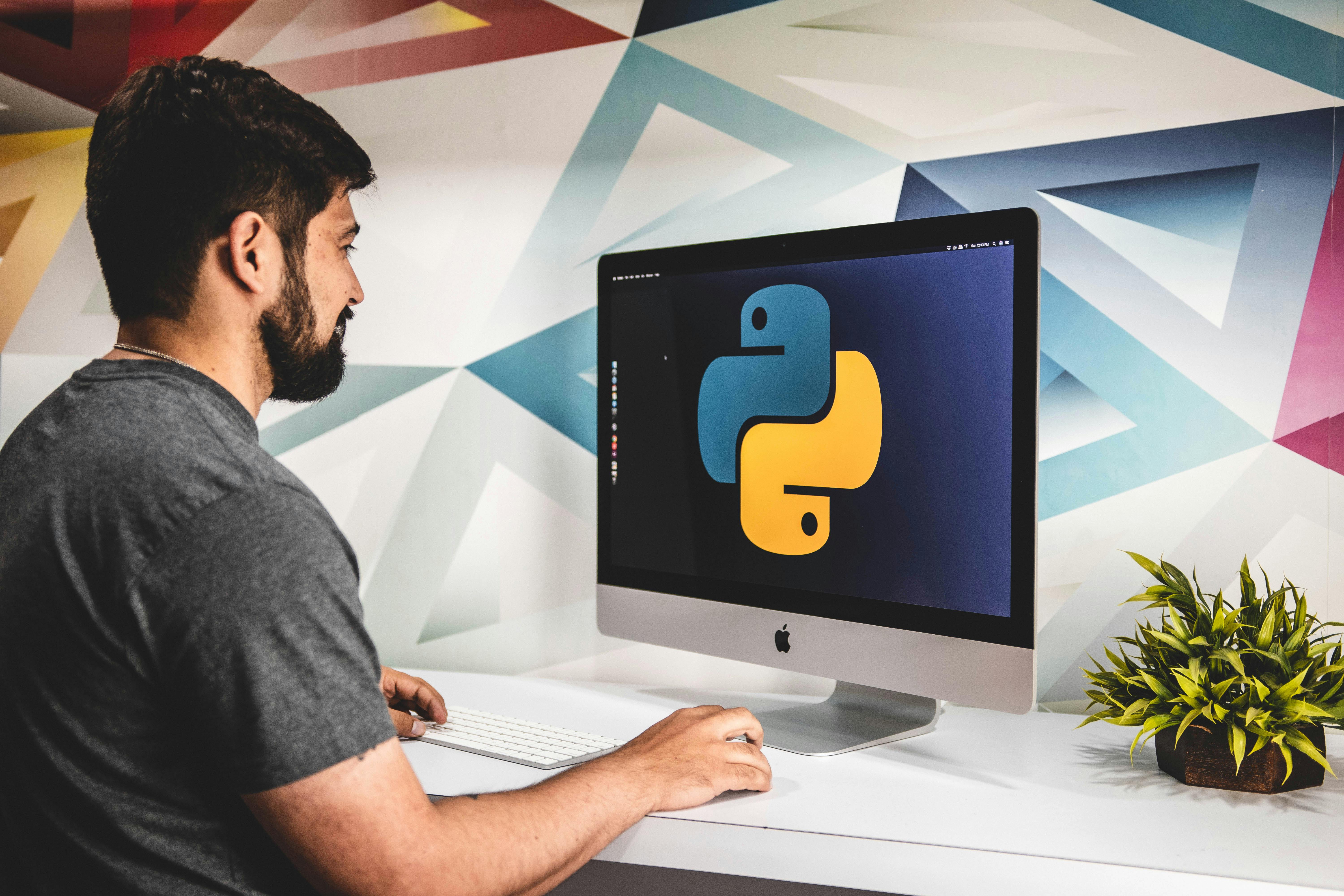 Selective Focus Photography of Man Facing Computer · Free Stock Photo