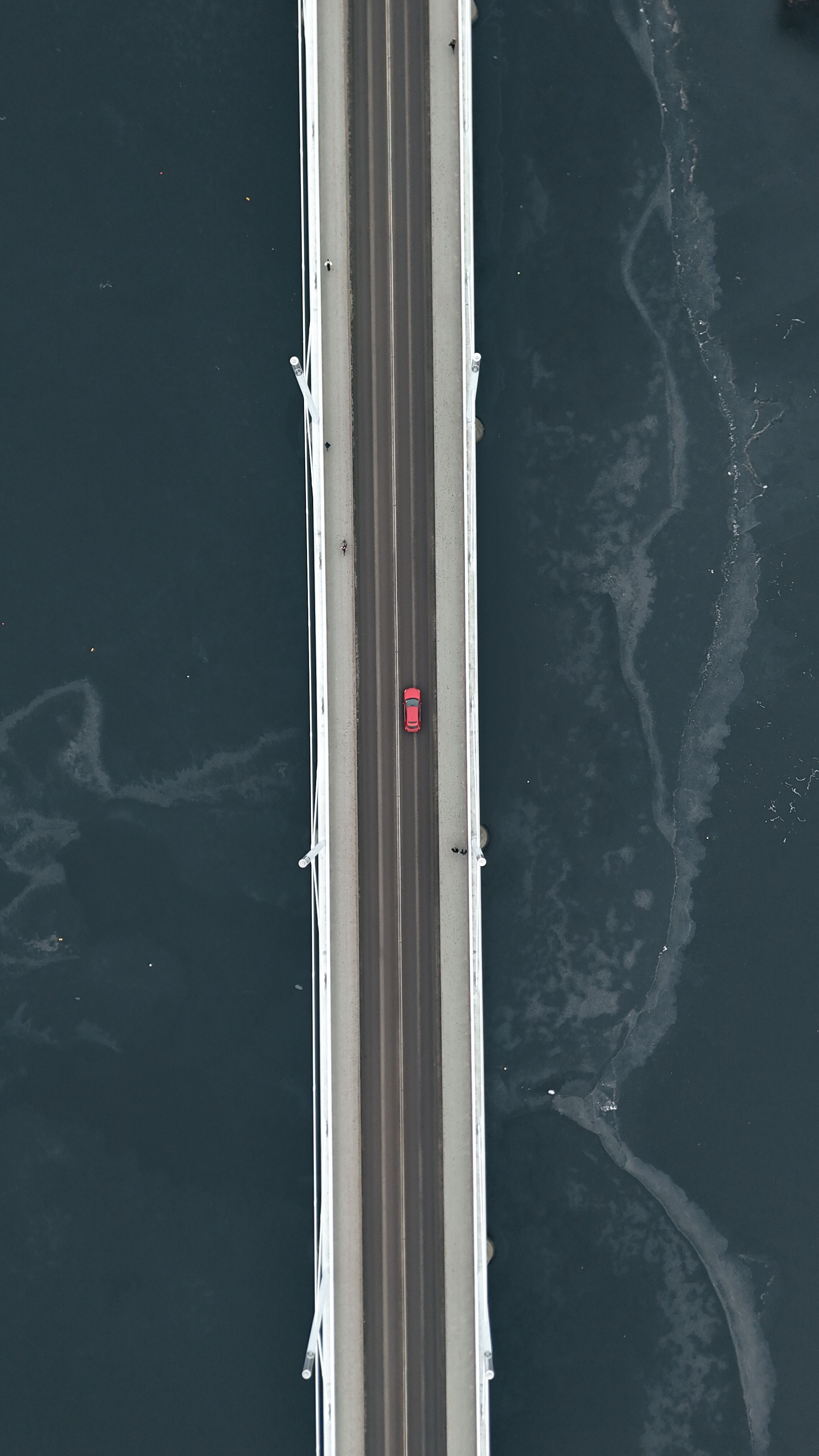 Aerial View of Red Car Driving on Bridge in Sweden · Free Stock Photo