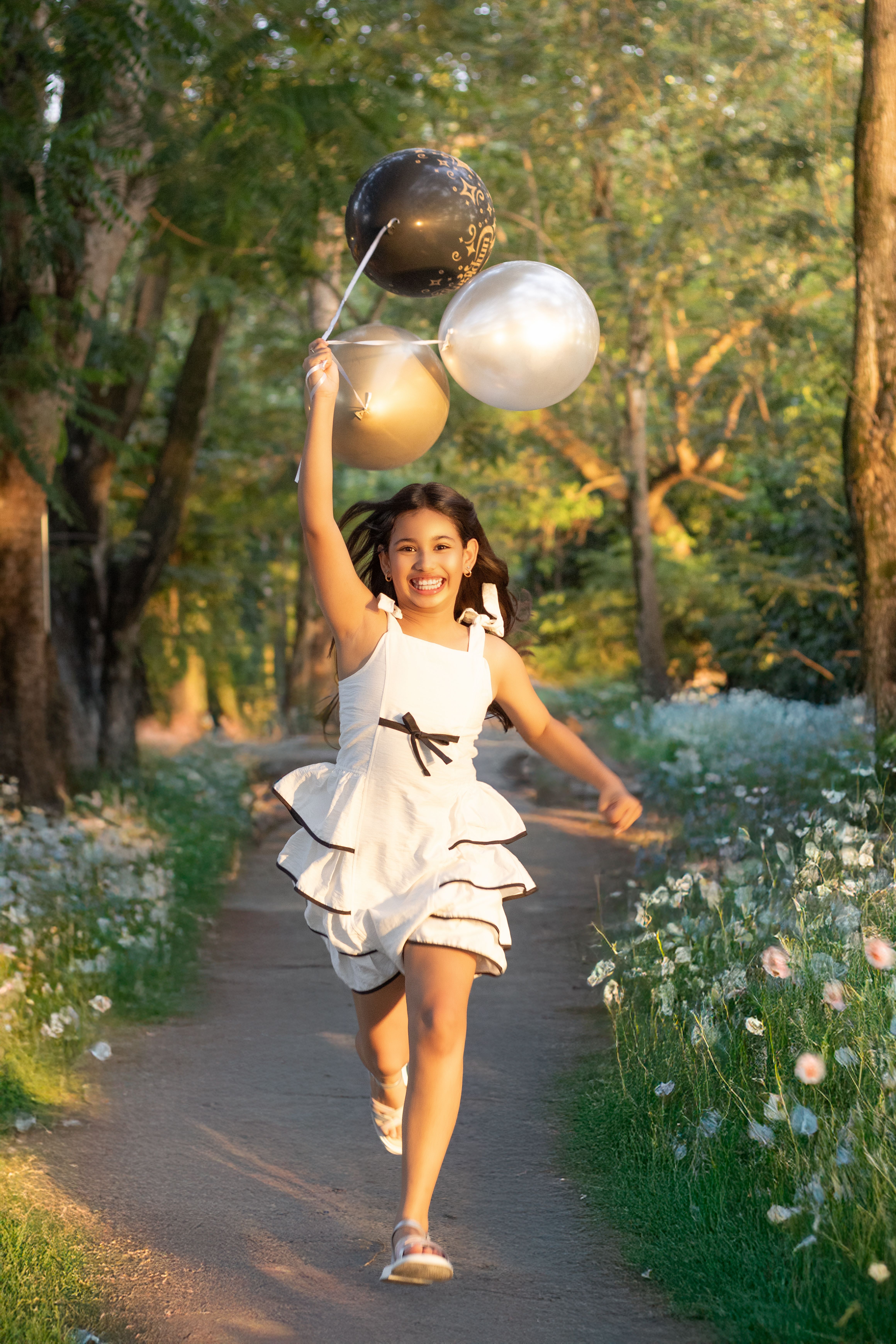 Joyful girl running with balloons in park · Free Stock Photo