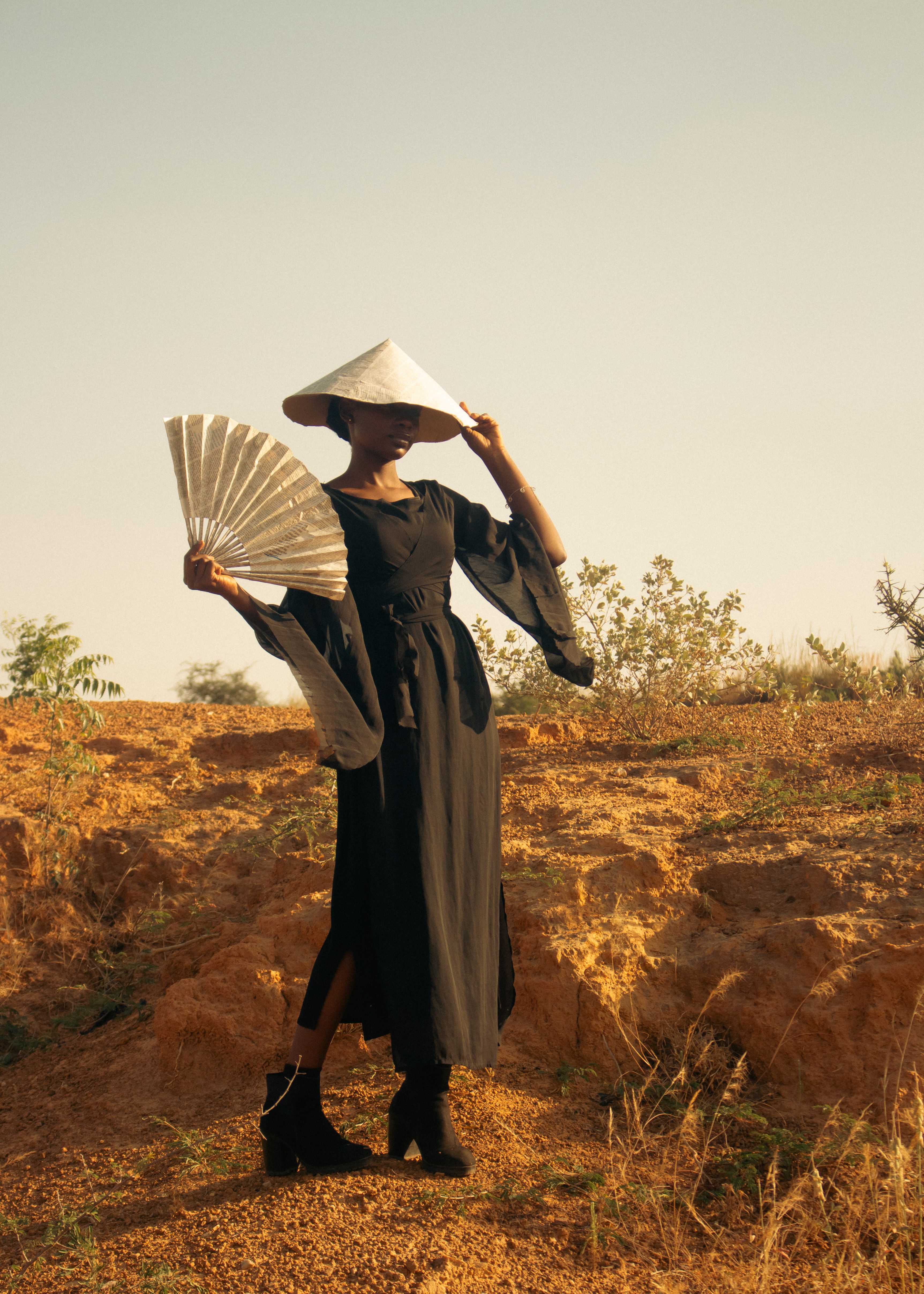 Woman in Black Dress with Traditional Asian Hat · Free Stock Photo
