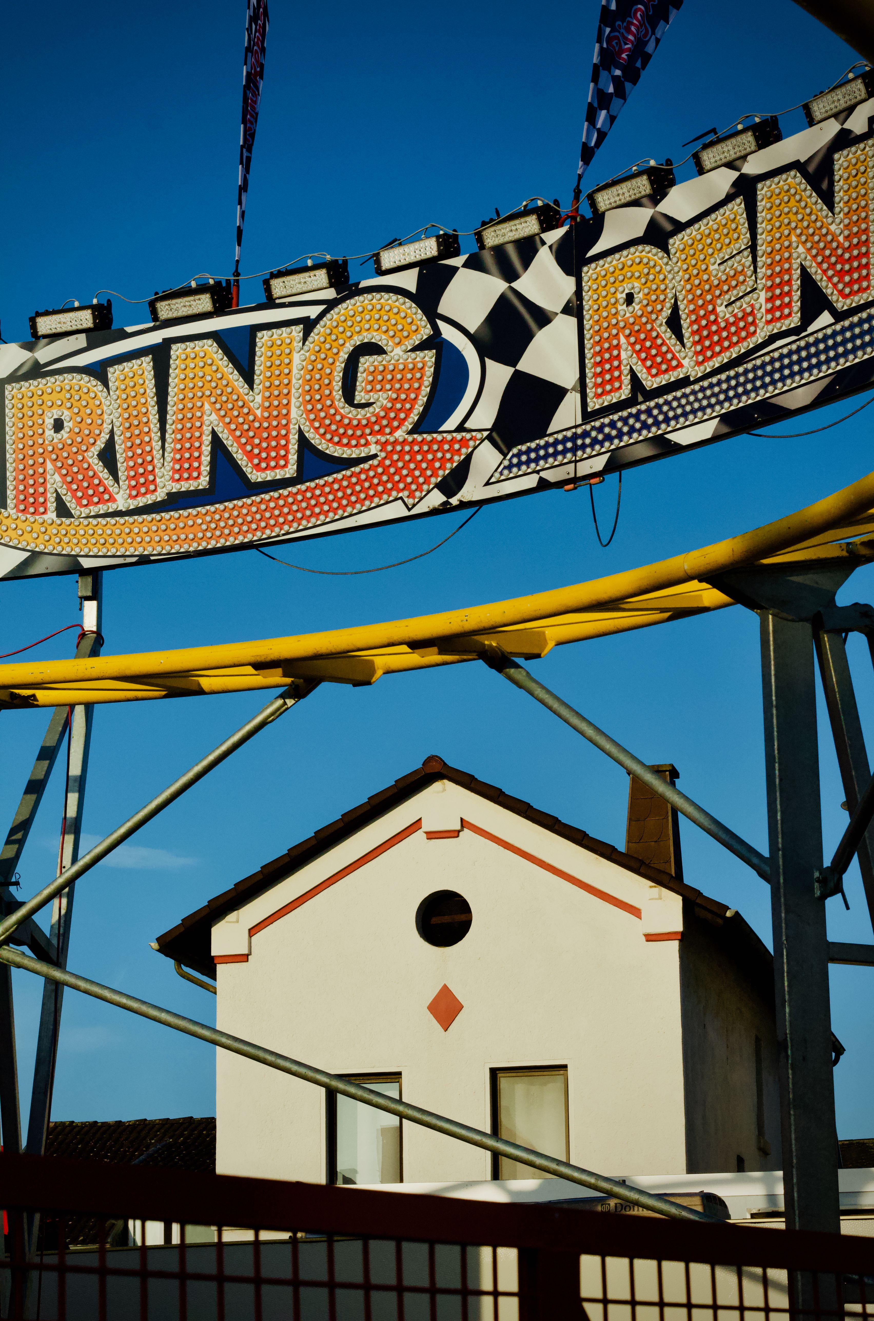 Amusement Park Ride with Vibrant Signage · Free Stock Photo