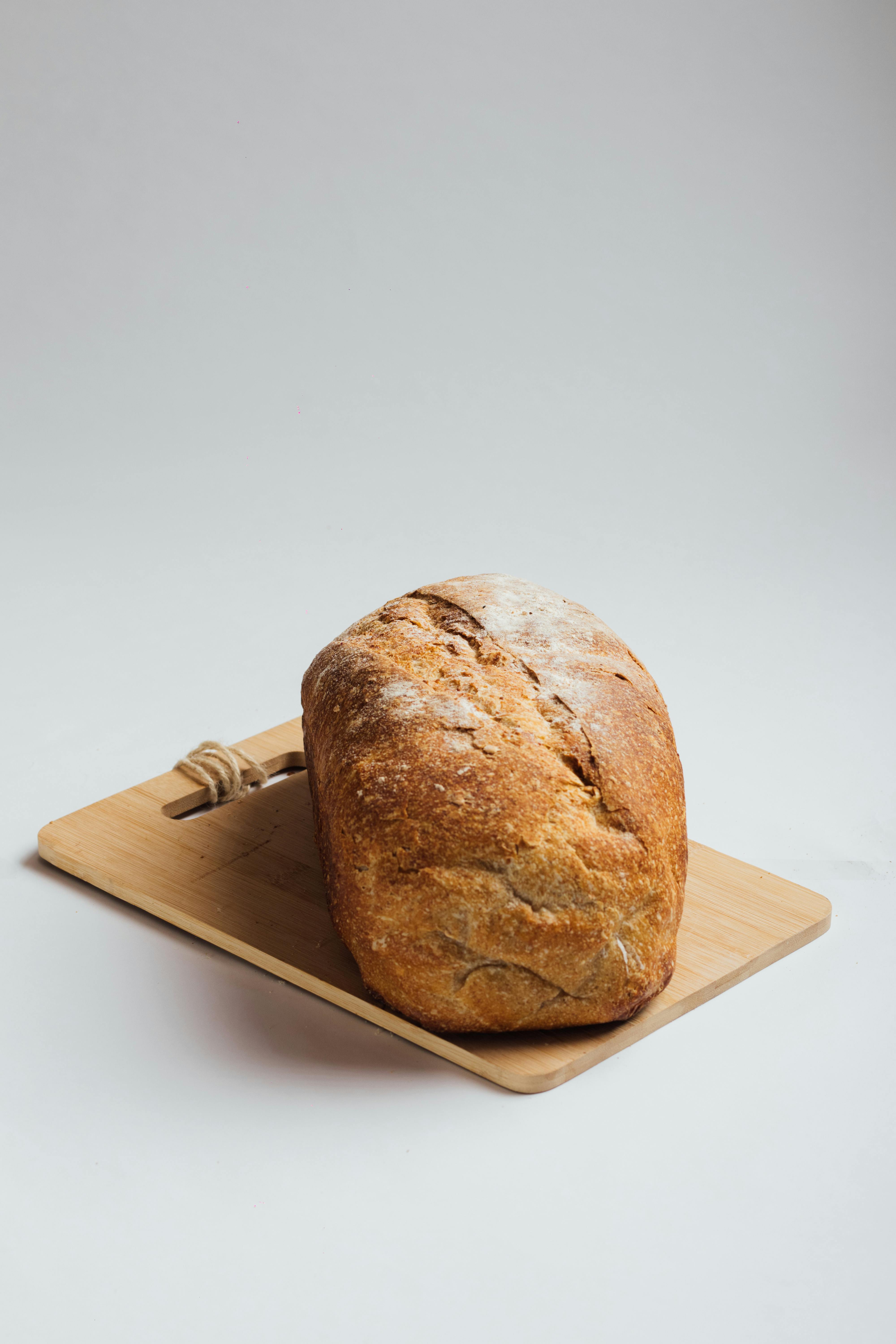 Freshly Baked Artisan Bread on Wooden Board · Free Stock Photo