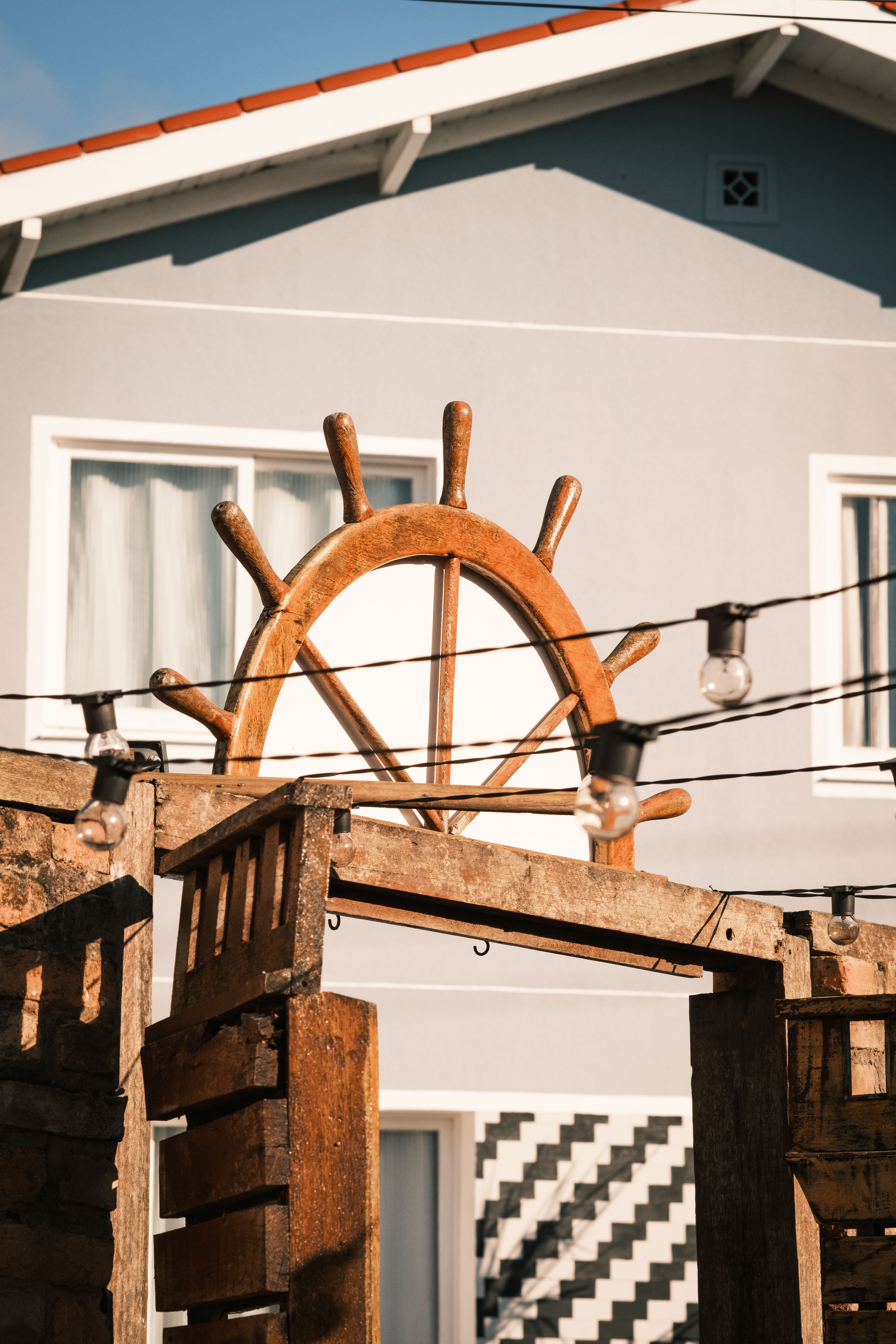 Rustic Wooden Ship Wheel Decor Outdoors · Free Stock Photo