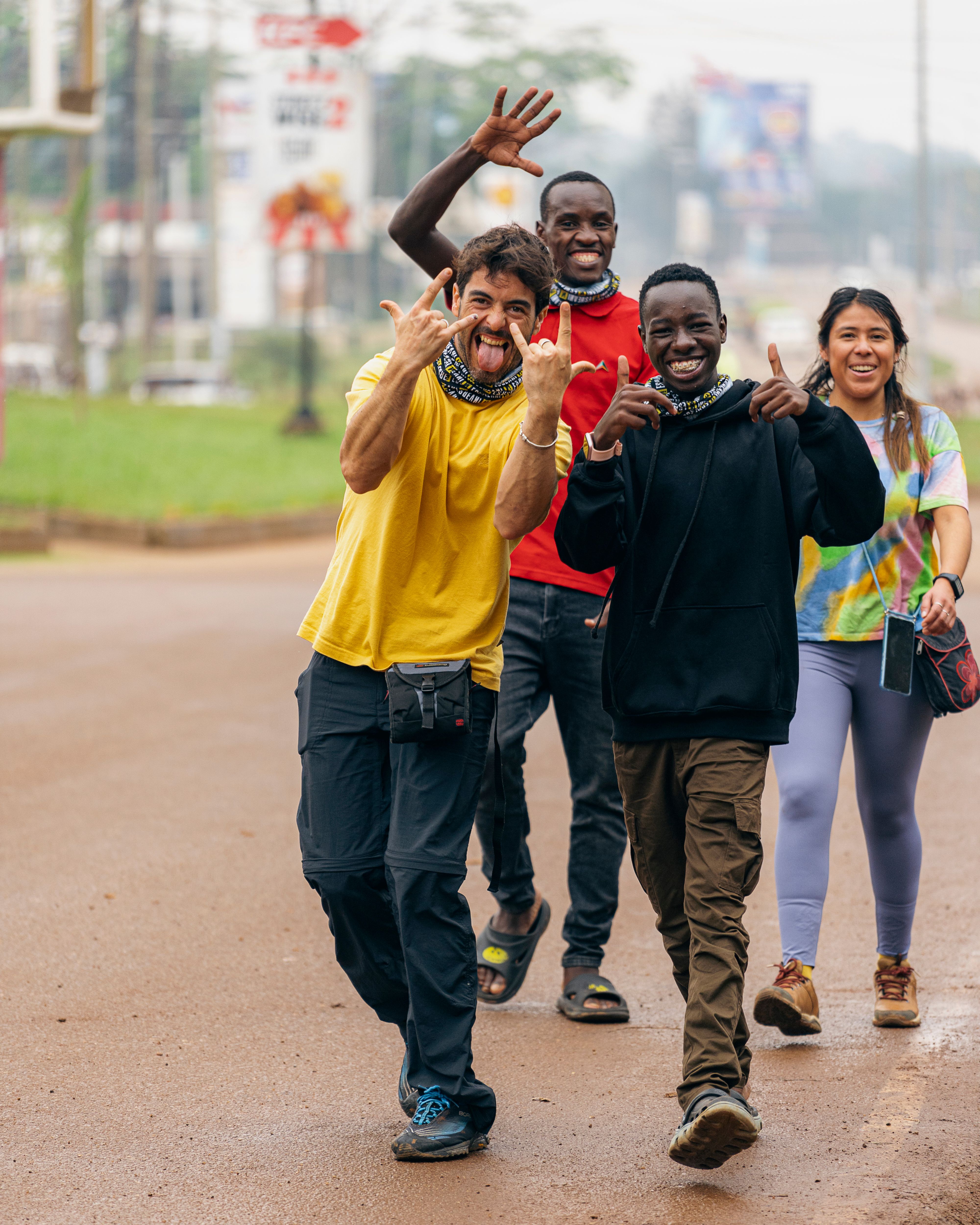Group of Friends Walking Joyfully on a Street · Free Stock Photo