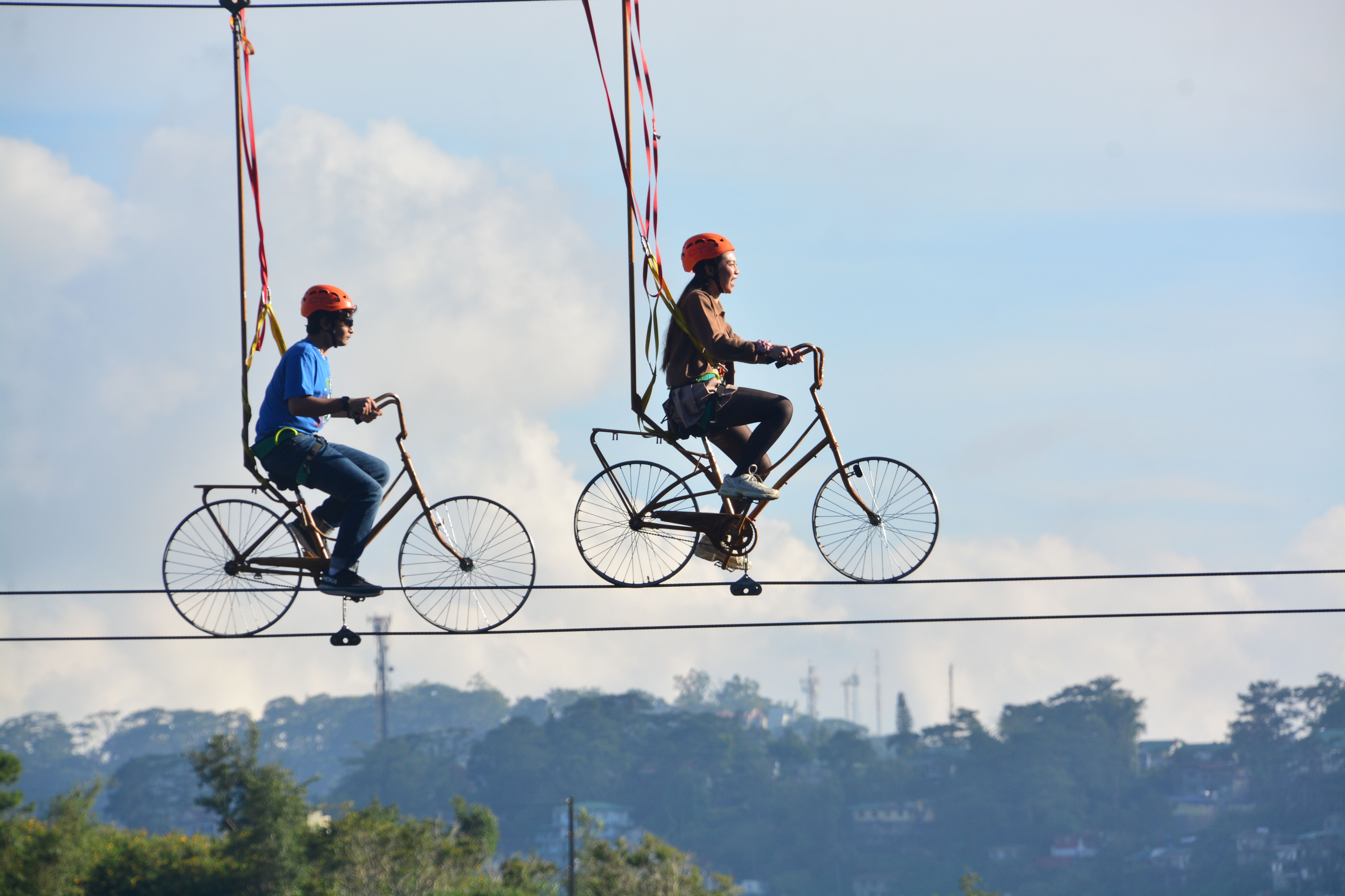 Daring High-Wire Bike Adventure in the Sky · Free Stock Photo