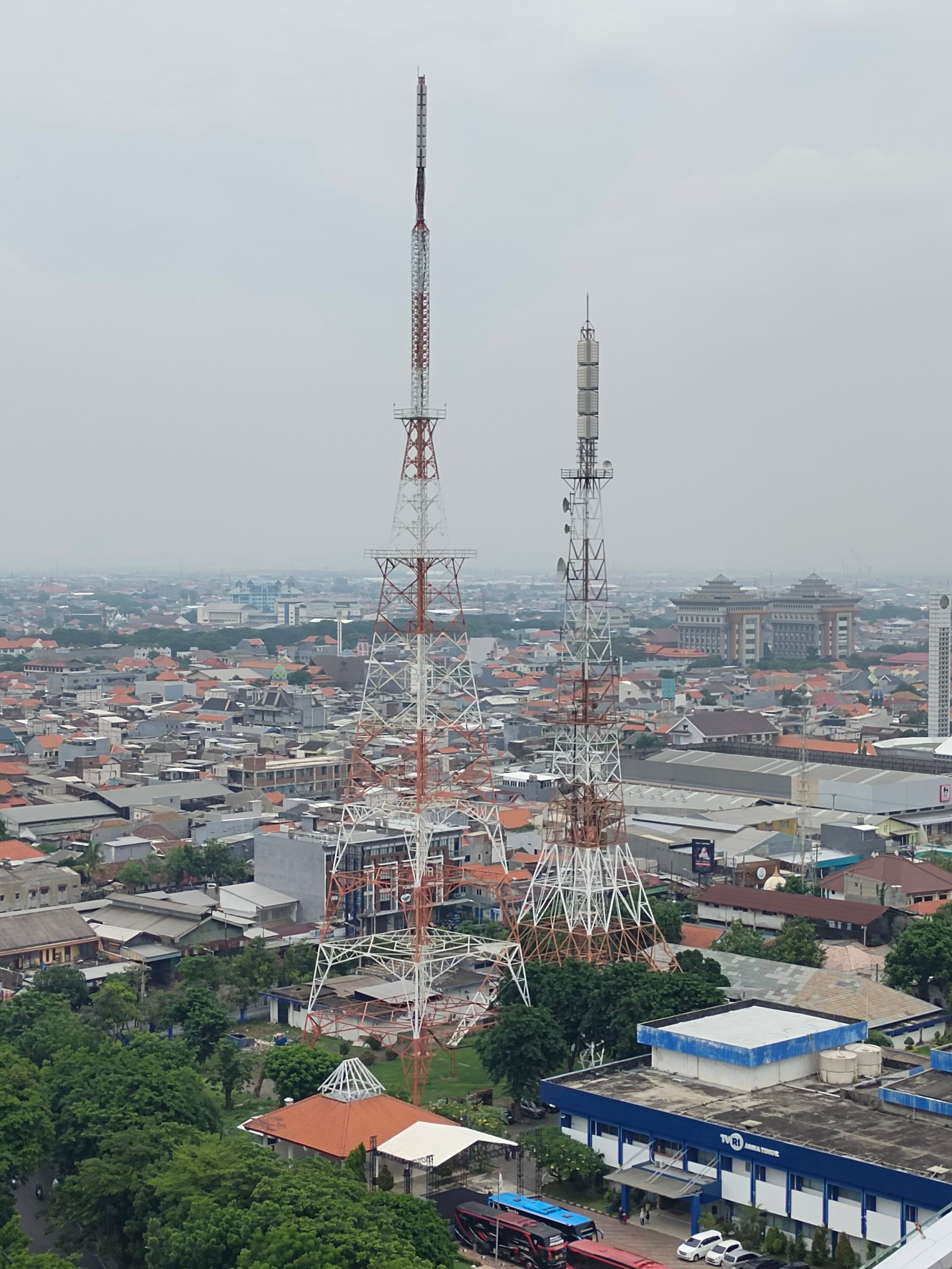 Aerial View of Communication Towers in Urban Setting · Free Stock Photo