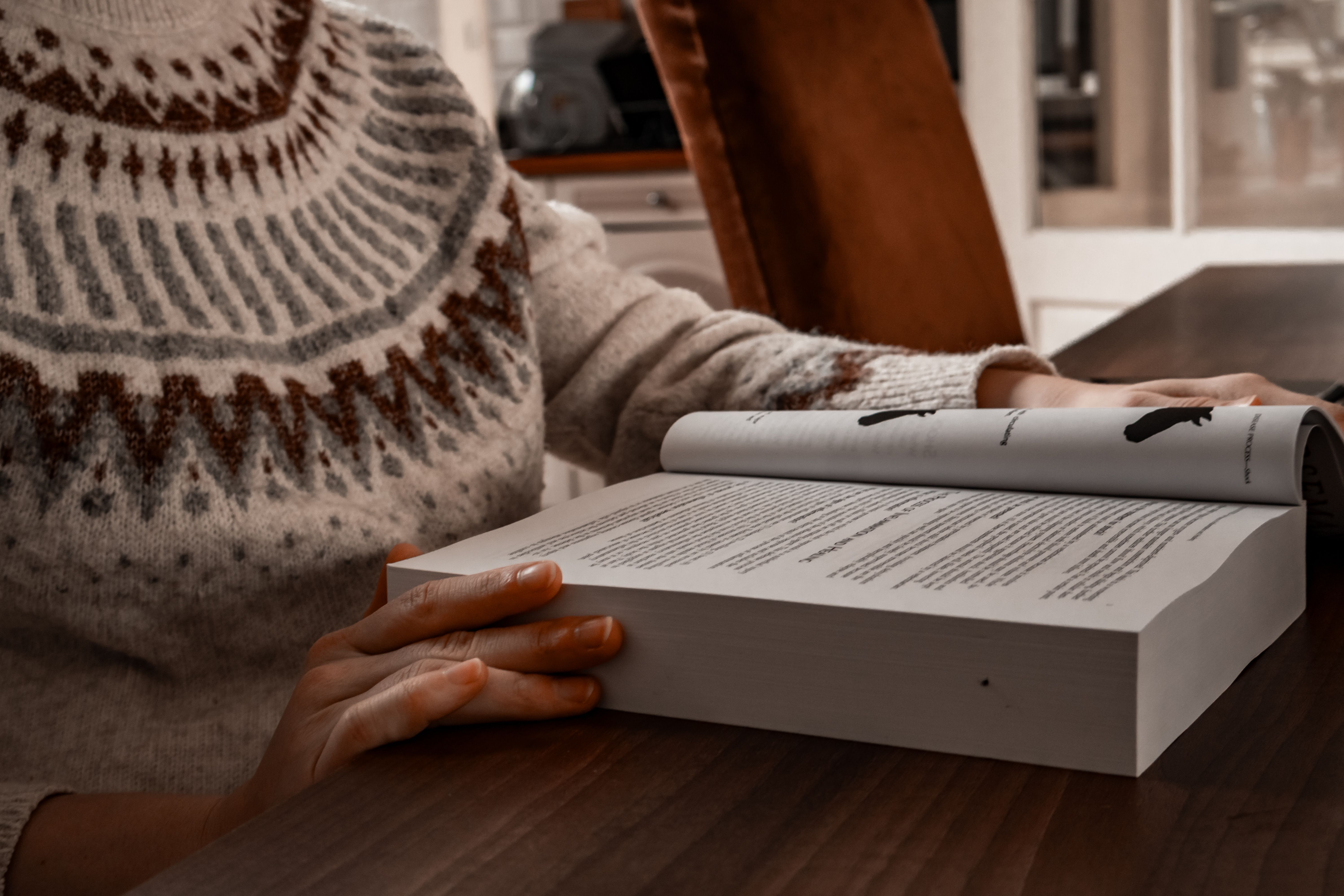 Cozy Reading Indoors with Open Book · Free Stock Photo