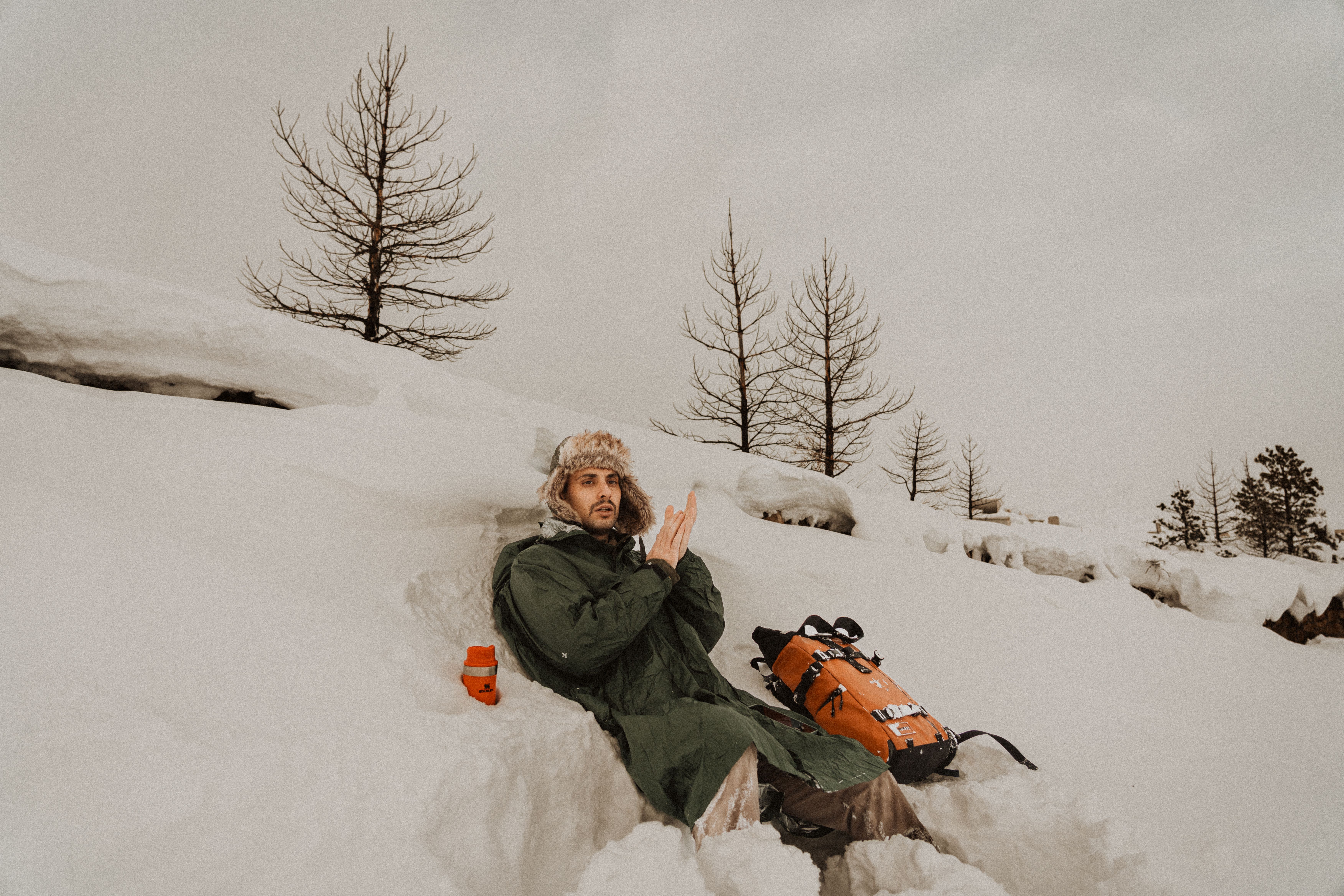 Winter Adventurer Clapping in Snowy Terrain · Free Stock Photo