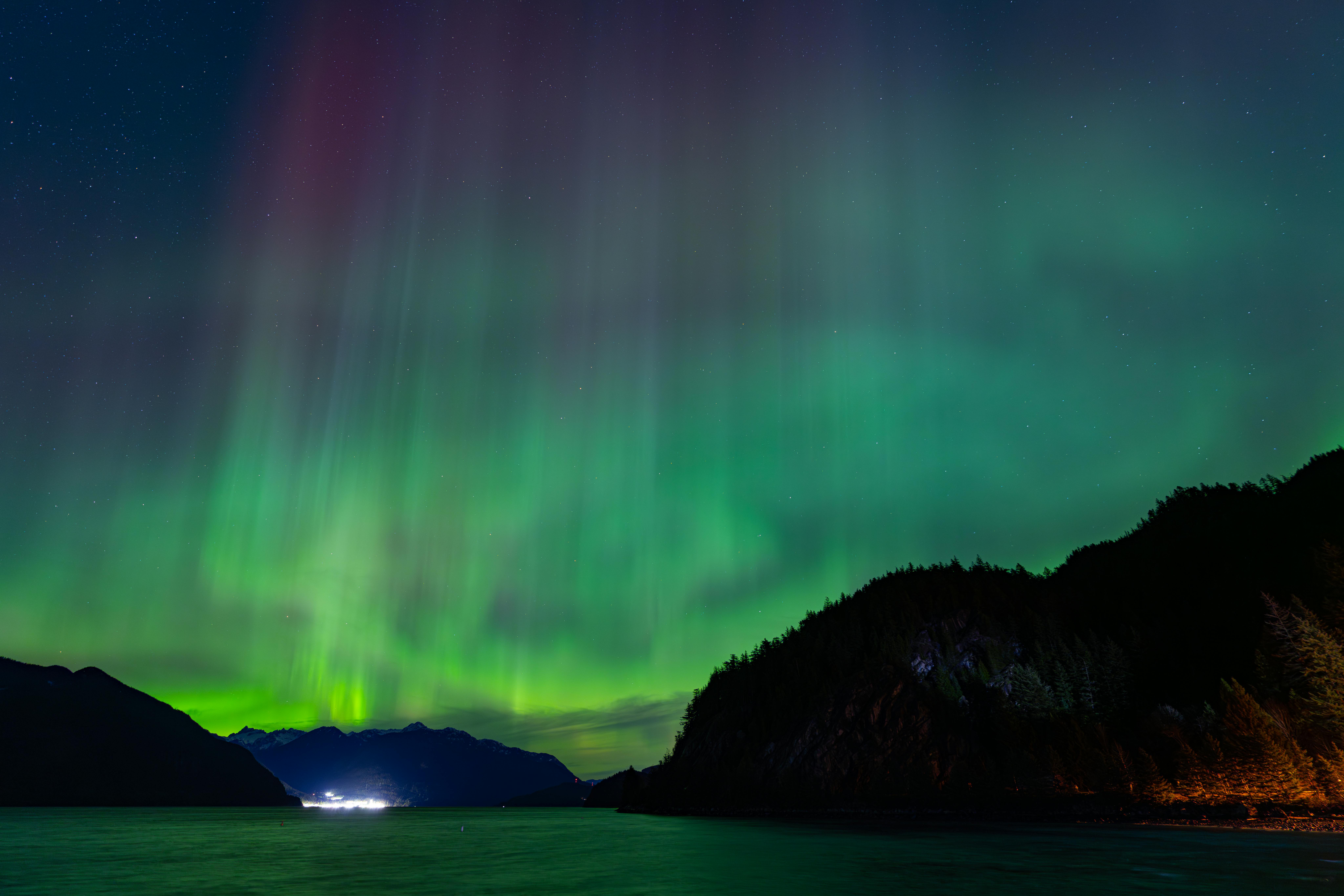 Spectacular Northern Lights Over Mountain Landscape · Free Stock Photo