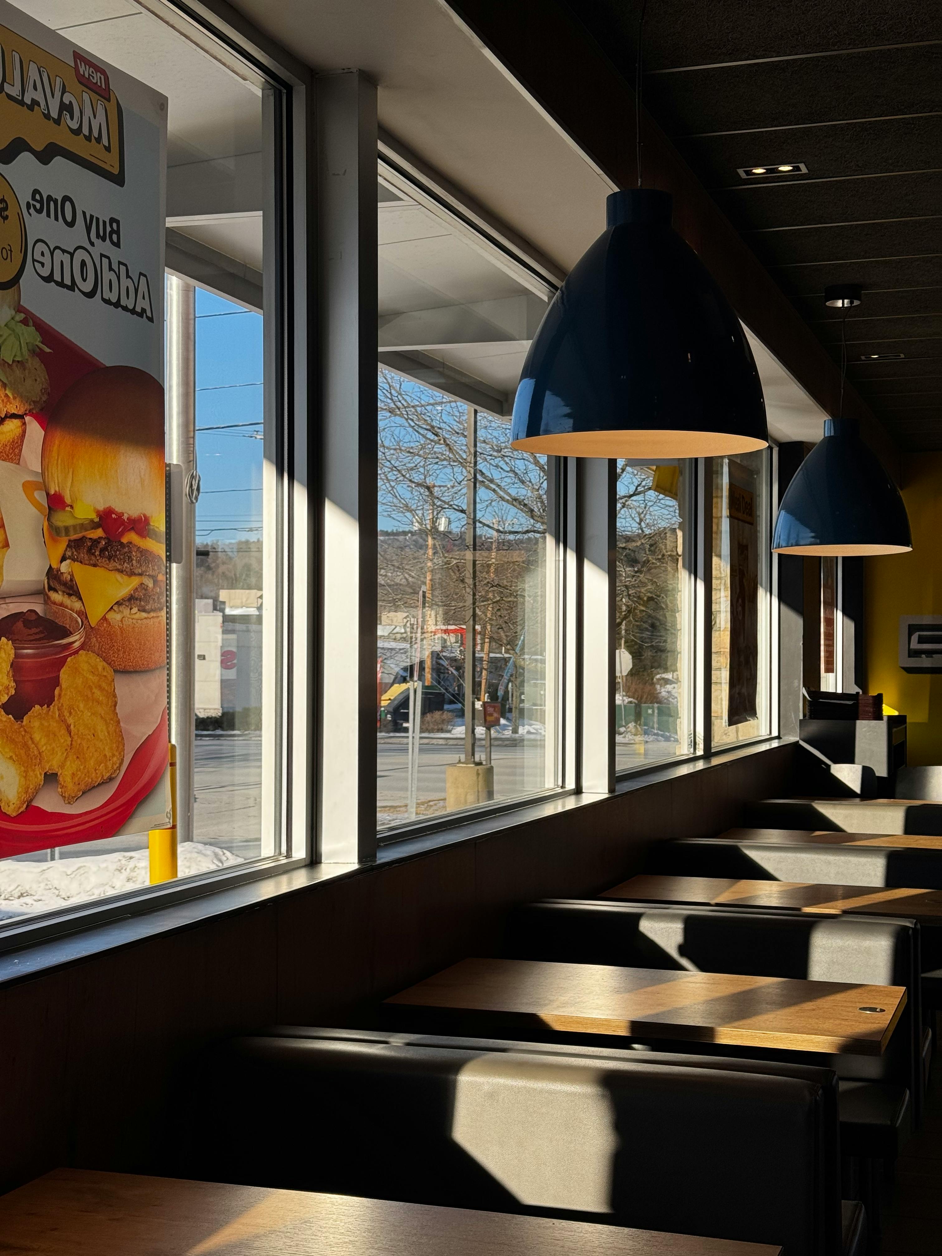 Cozy Fast Food Restaurant Interior with Window Lighting · Free Stock Photo