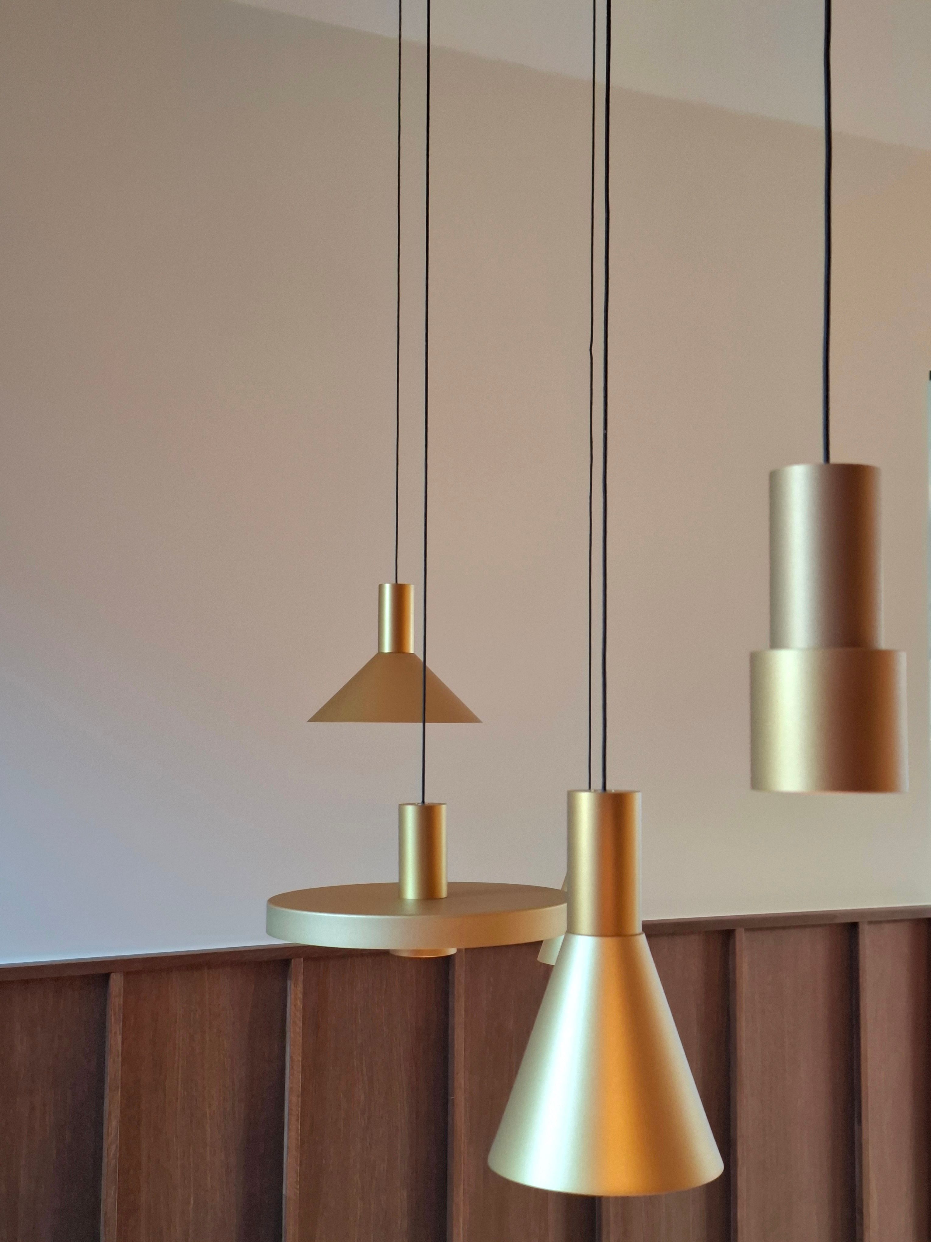 Modern Gold Pendant Lights in Minimalist Setting · Free Stock Photo