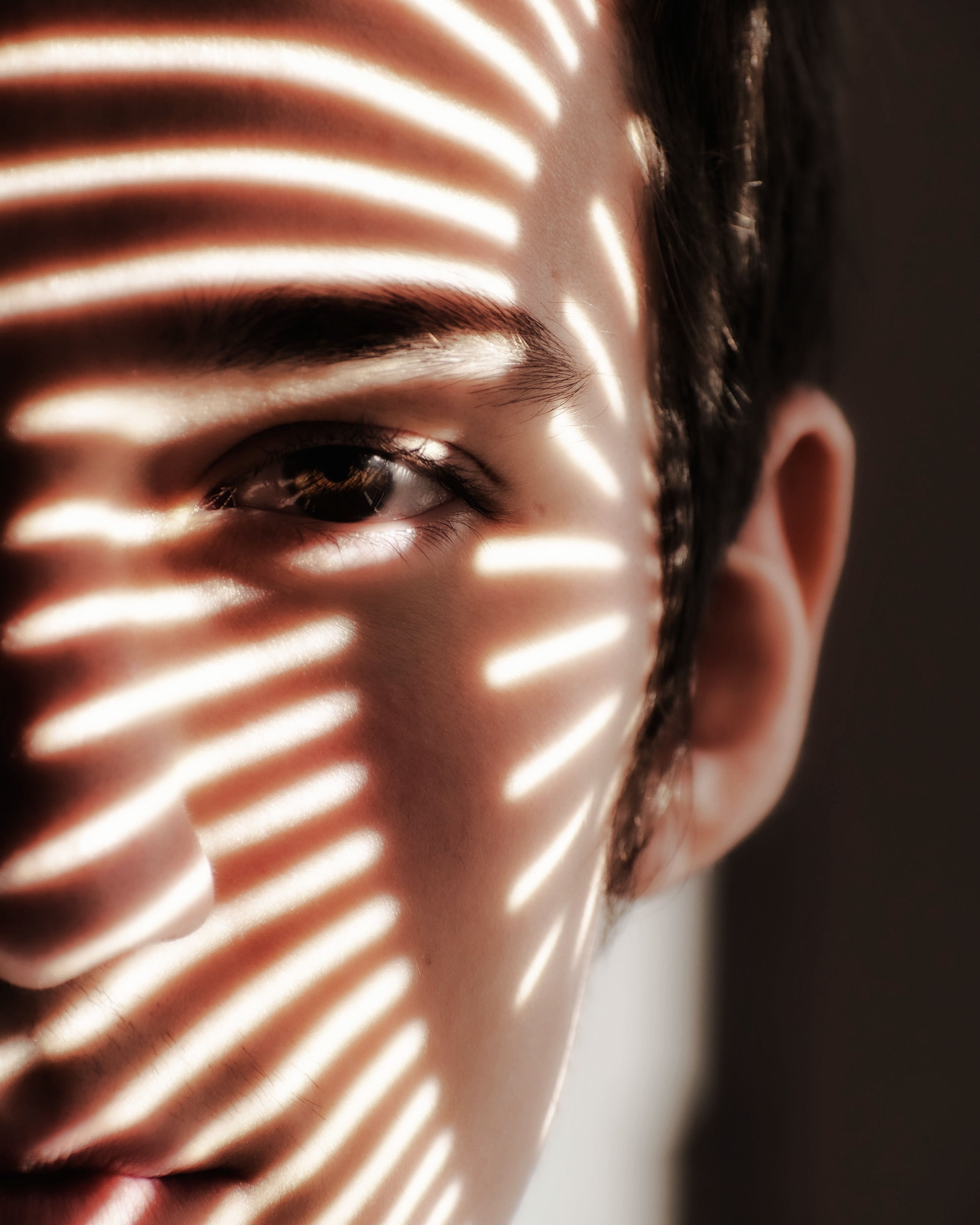 Young Adult with Dramatic Light and Shadows · Free Stock Photo
