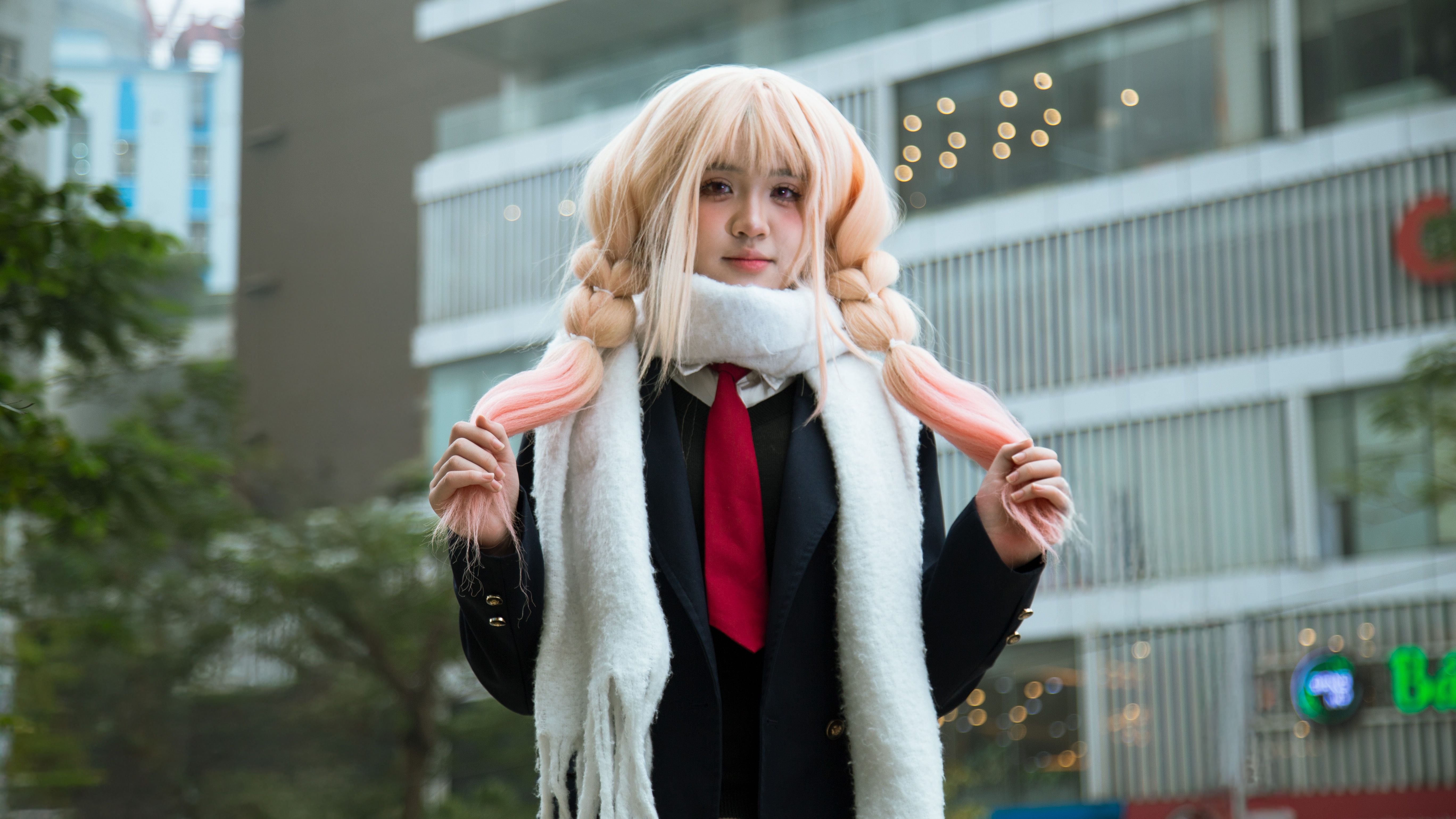 Cosplayer with pink hair in urban setting · Free Stock Photo