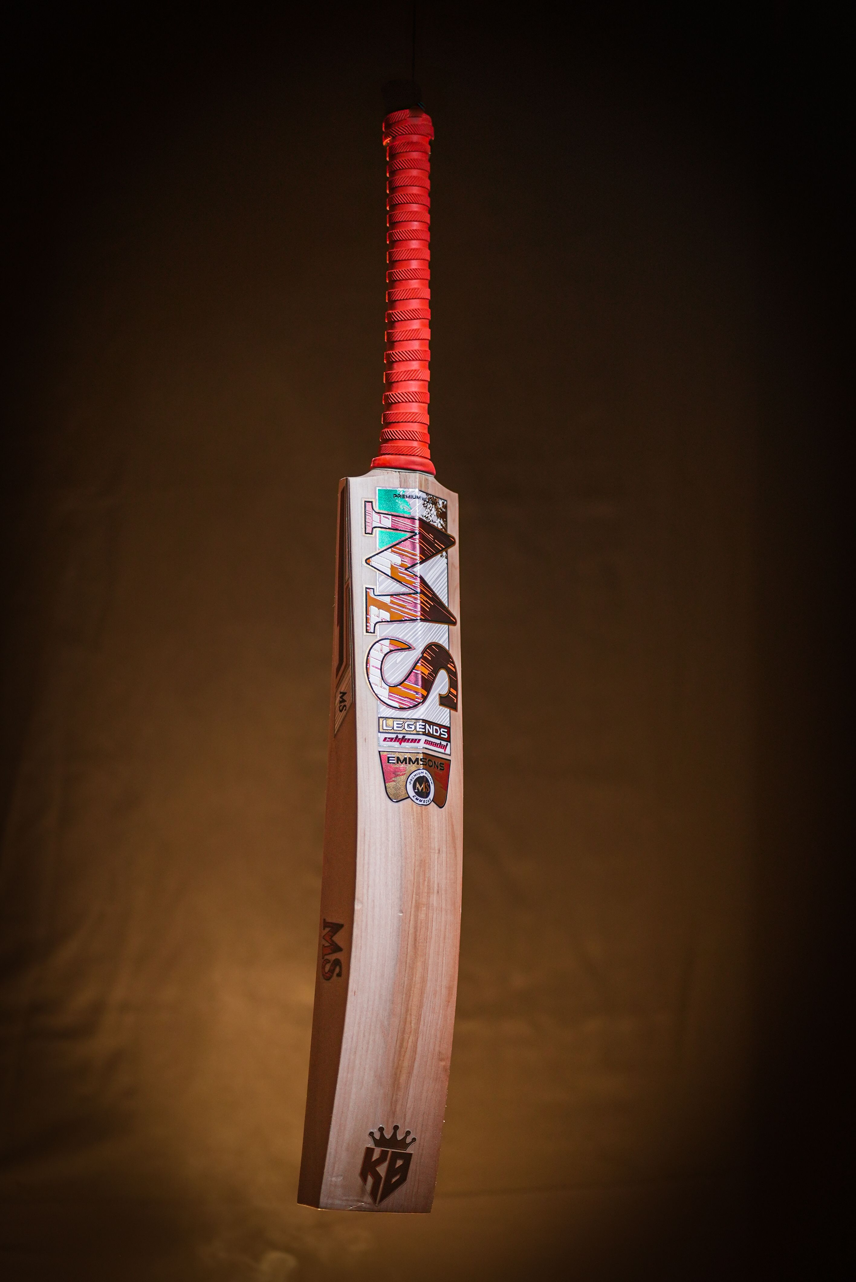Cricket Bat with Red Grip on Dark Background · Free Stock Photo